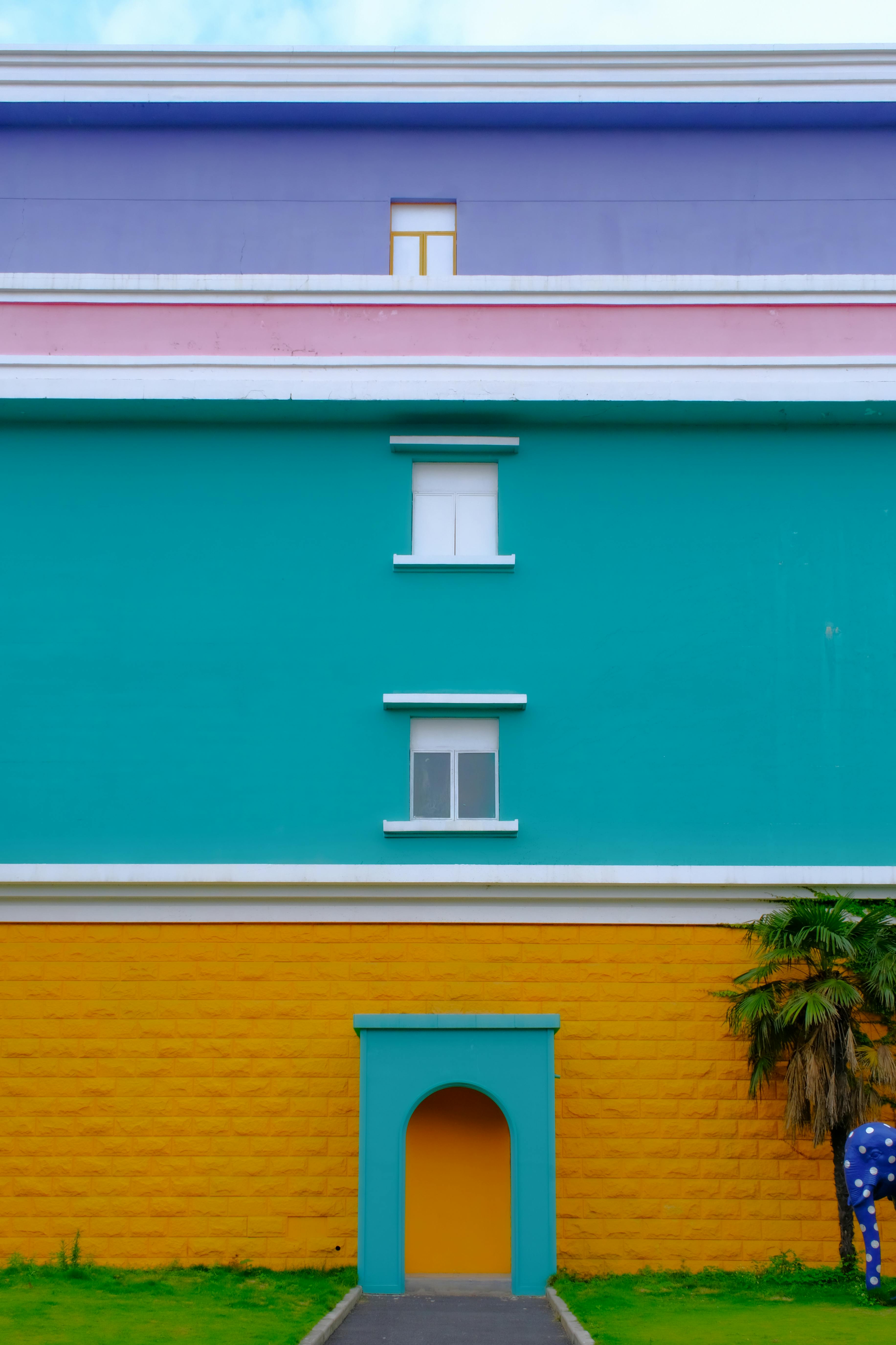 Colorful Building Facade with Geometric Patterns · Free Stock Photo