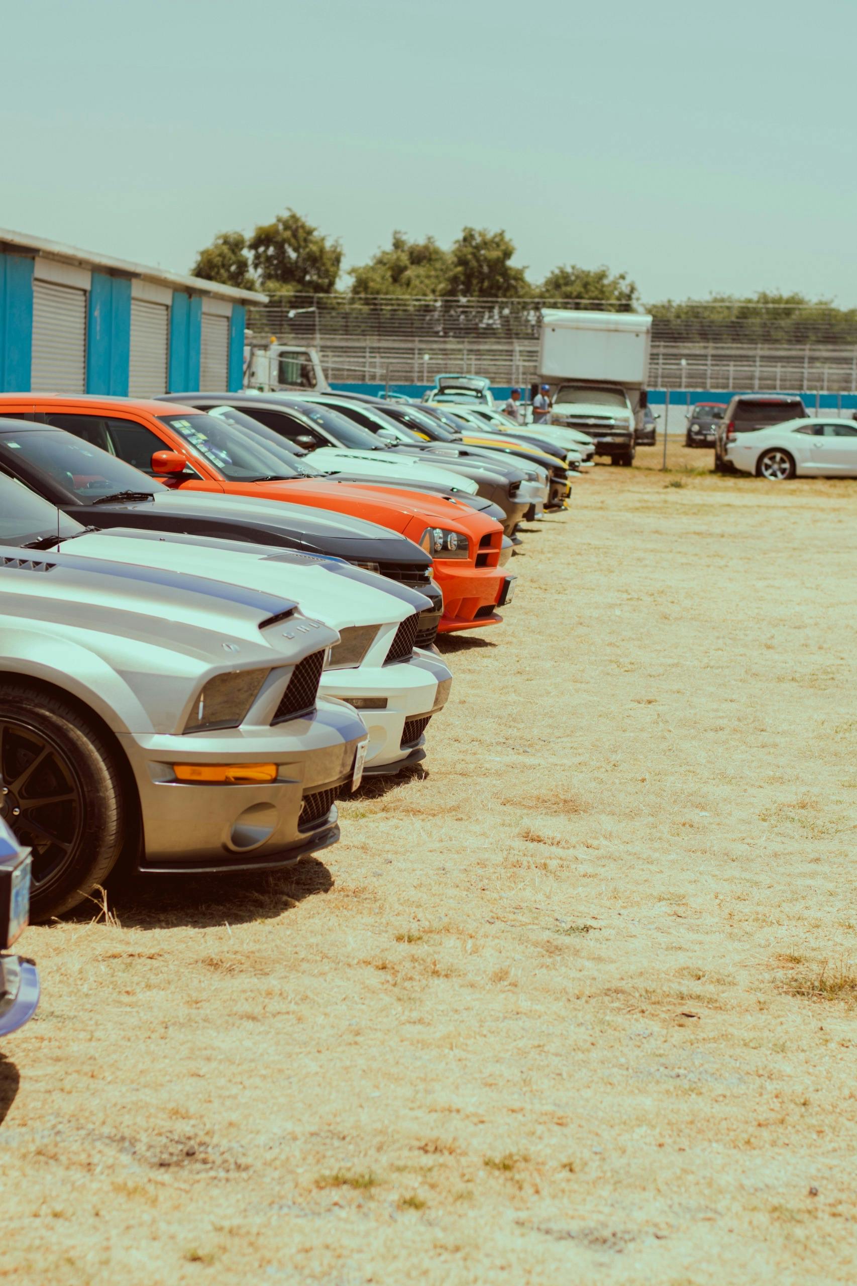 Row of Classic Sports Cars at Outdoor Auto Show · Free Stock Photo