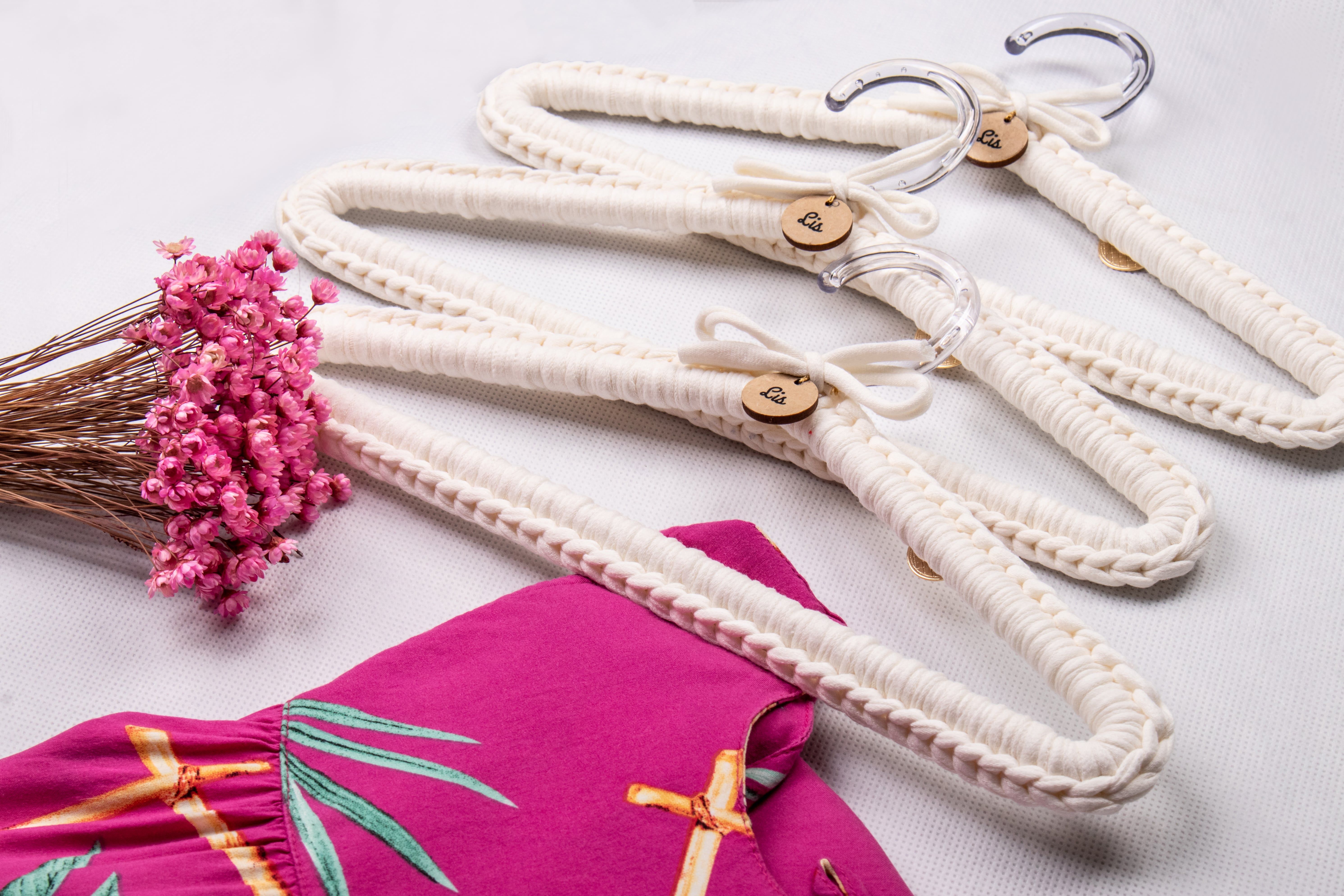 Elegant Hangers with Floral Display and Pink Patterned Cloth · Free ...