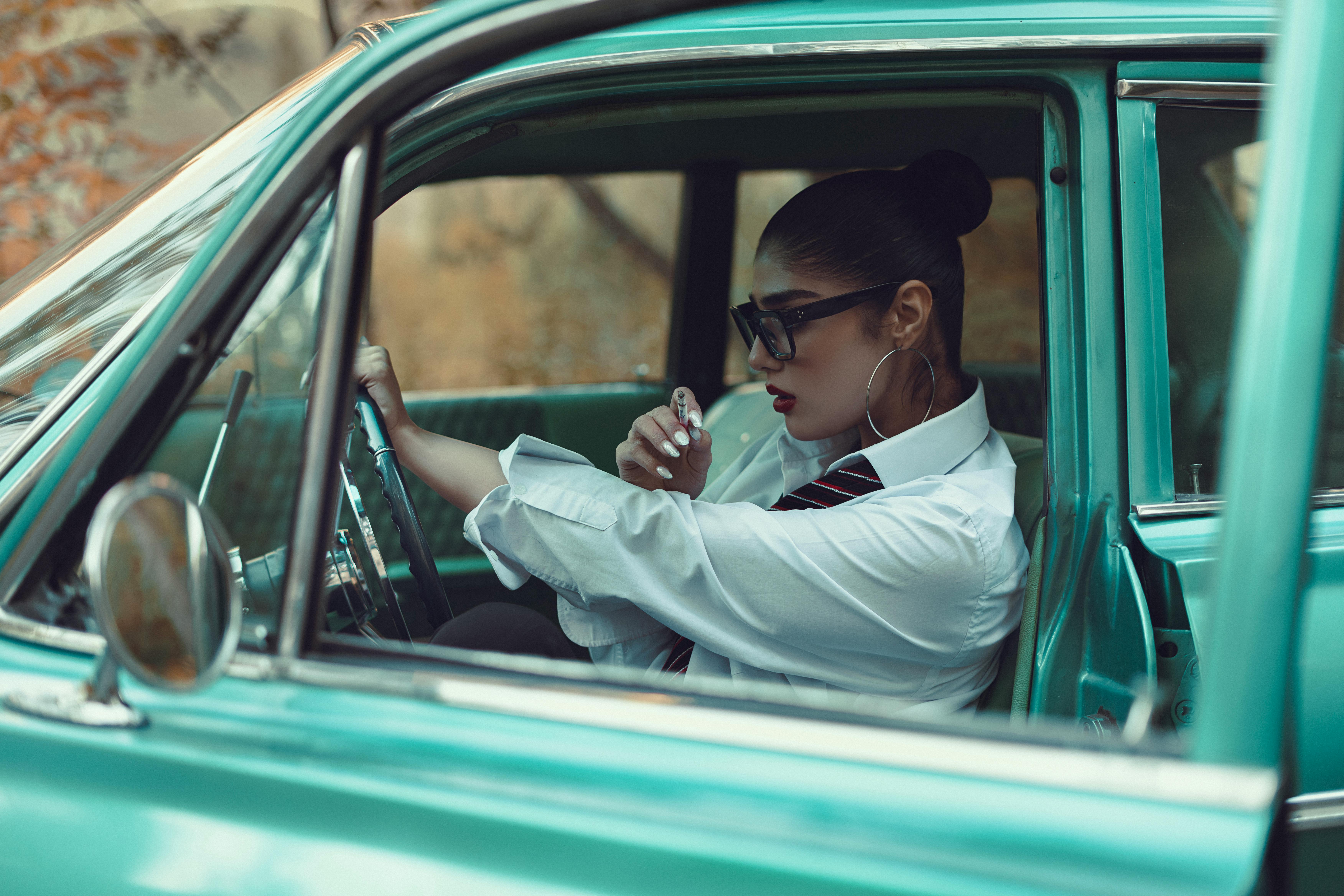 Stylish Woman Driving Vintage Teal Car Outdoors · Free Stock Photo