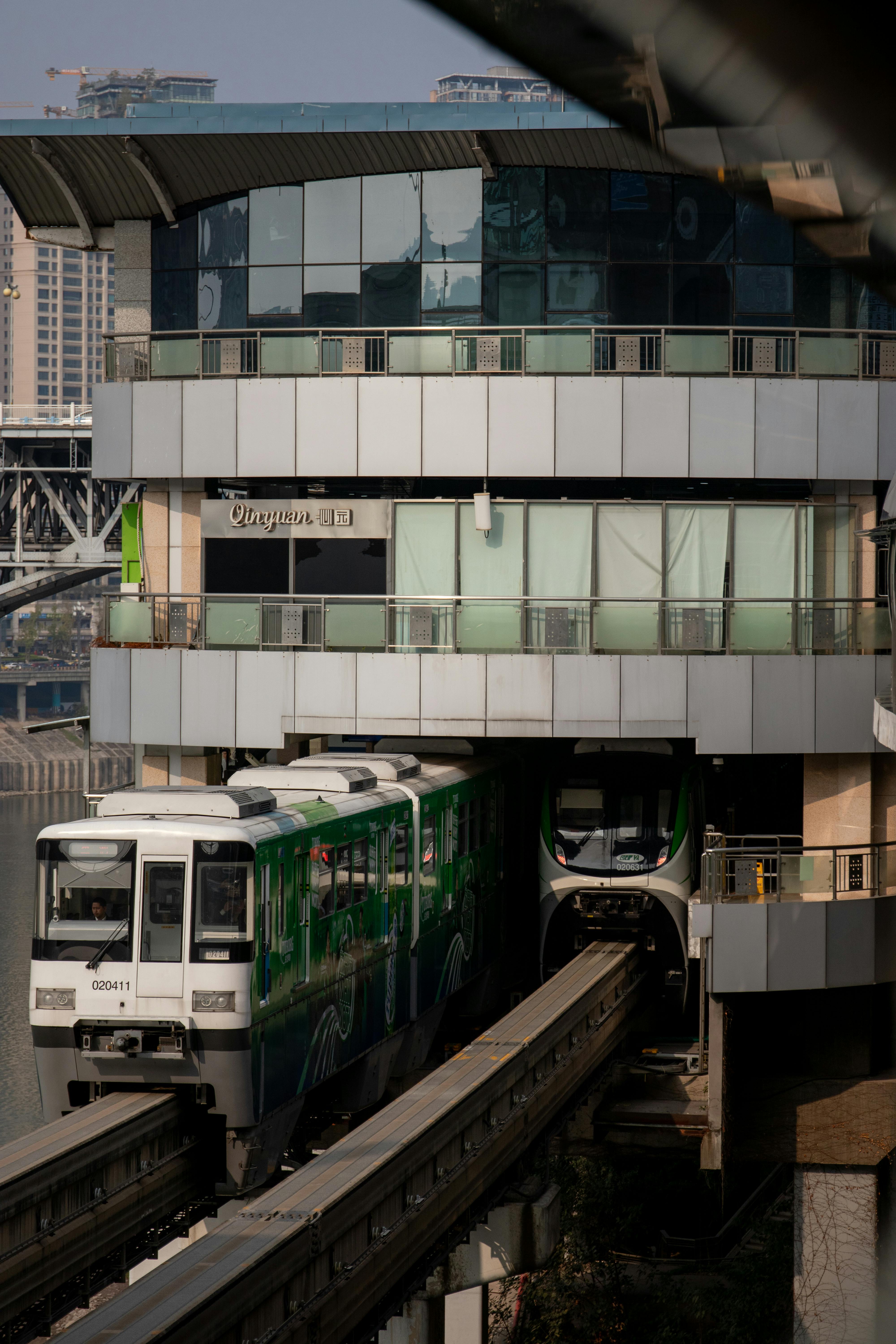 Monorail Passing Through Urban Architecture · Free Stock Photo