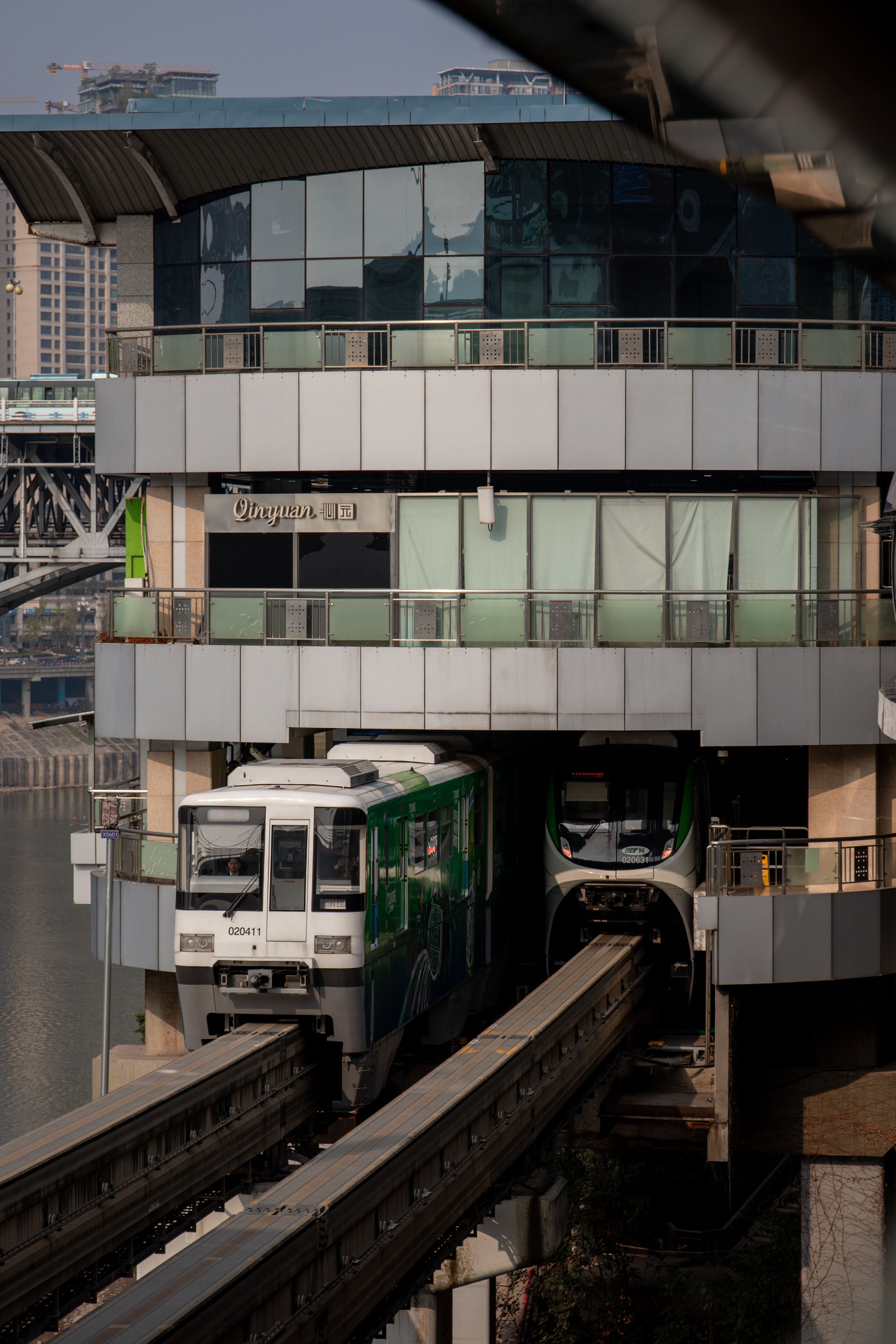 Modern Urban Monorail Passing Through Building · Free Stock Photo