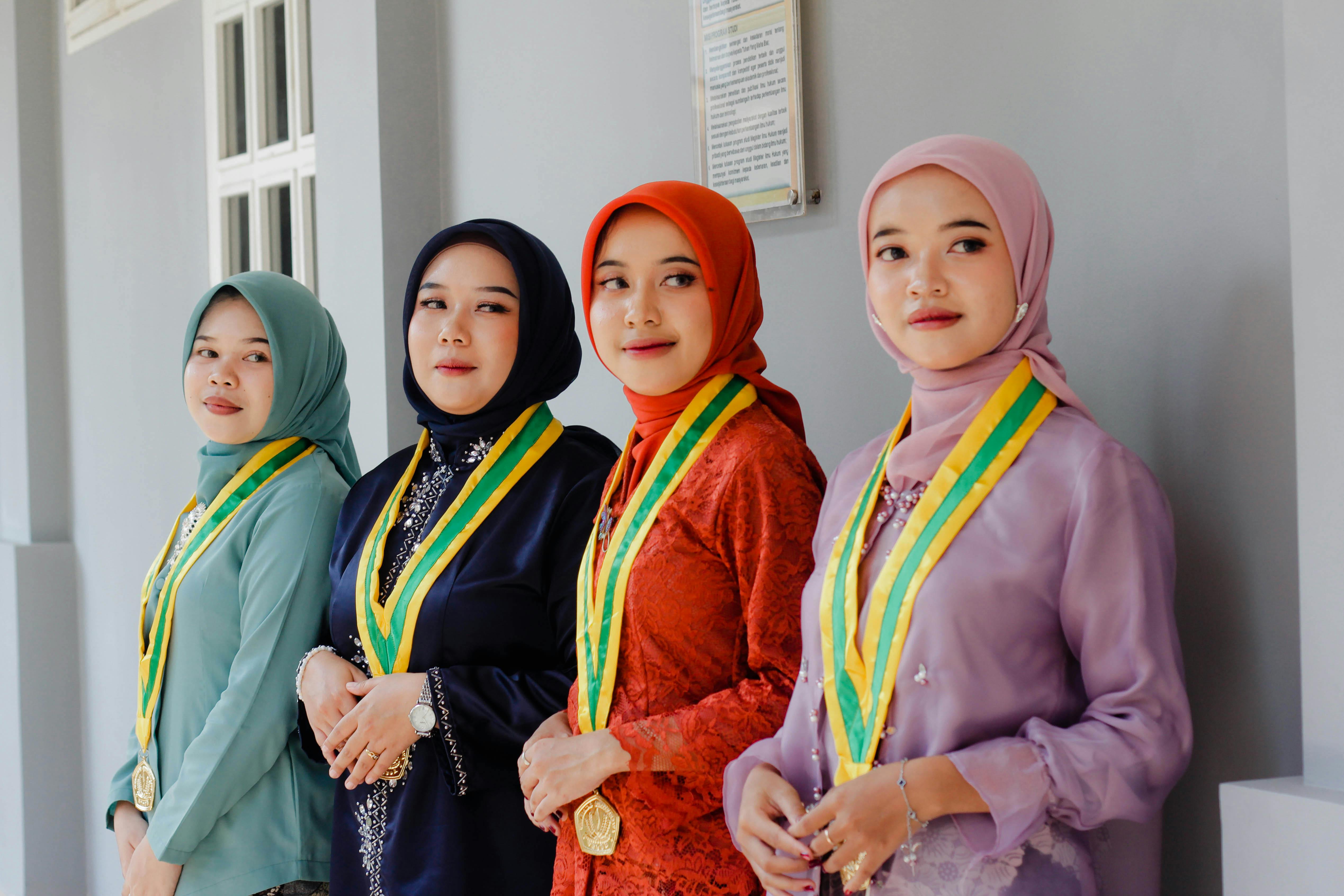 Diverse Group of Young Graduates in Colorful Hijabs · Free Stock Photo