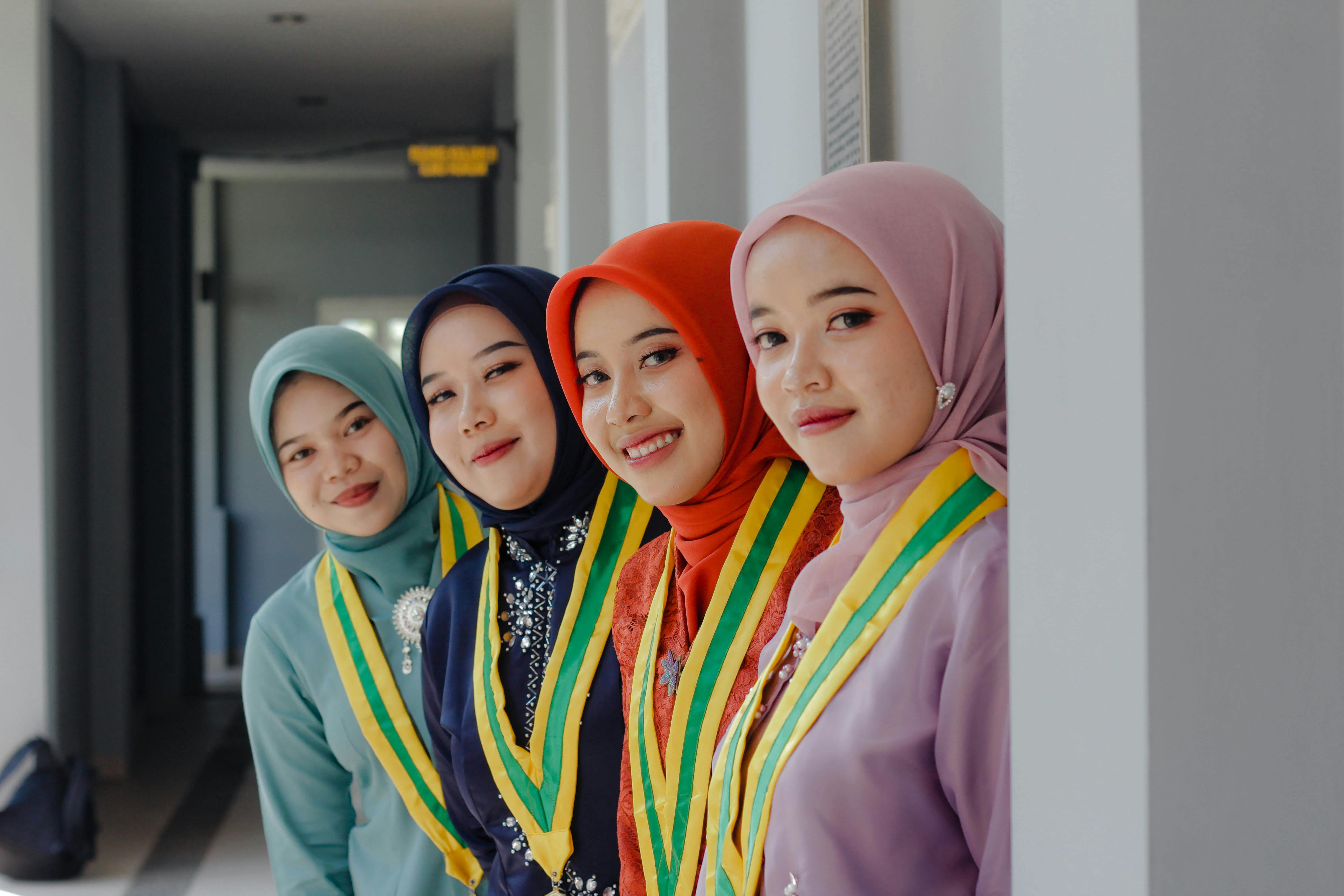 Graduation Ceremony with Smiling Students in Hijabs · Free Stock Photo