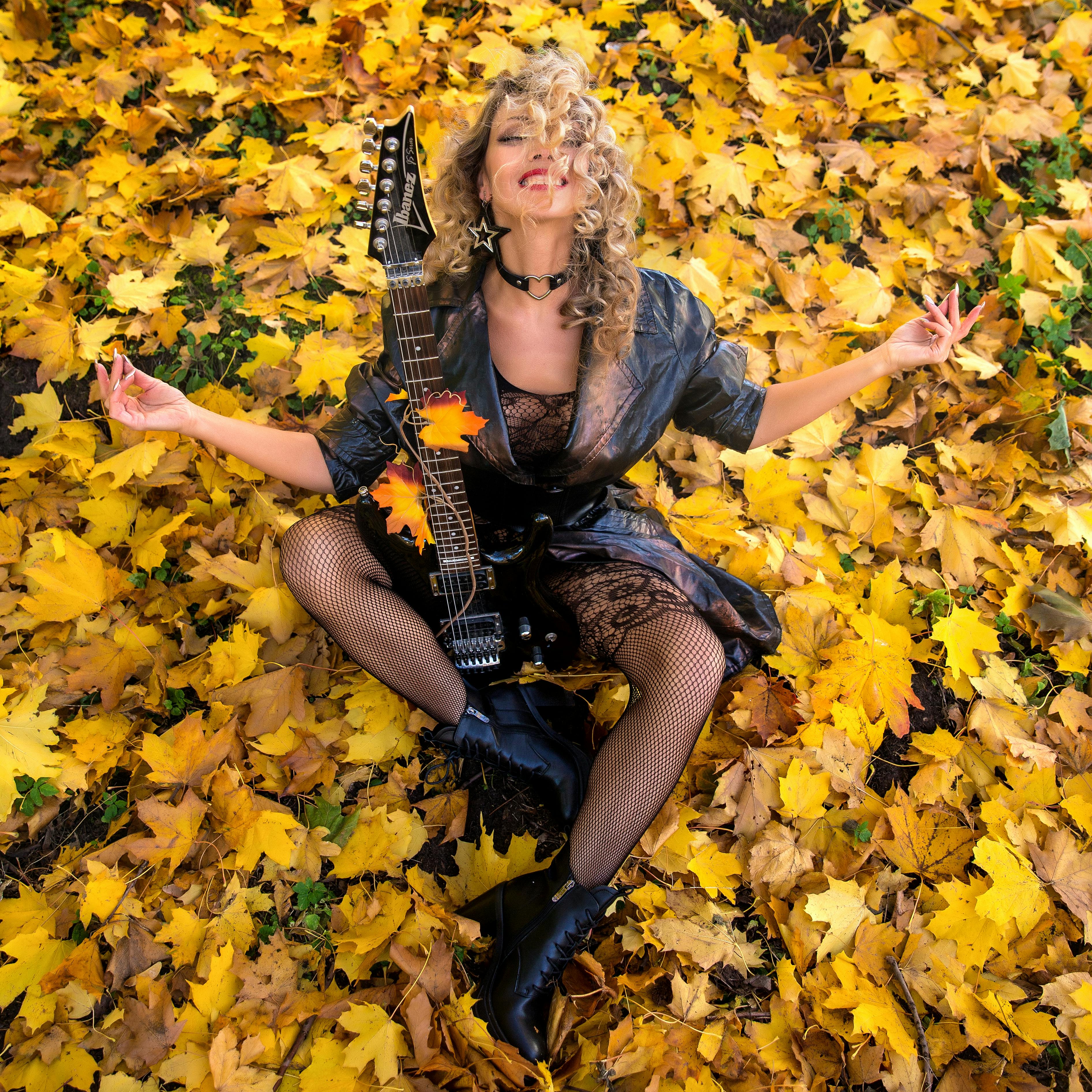 Autumn Rock Vibes Woman with Electric Guitar · Free Stock Photo