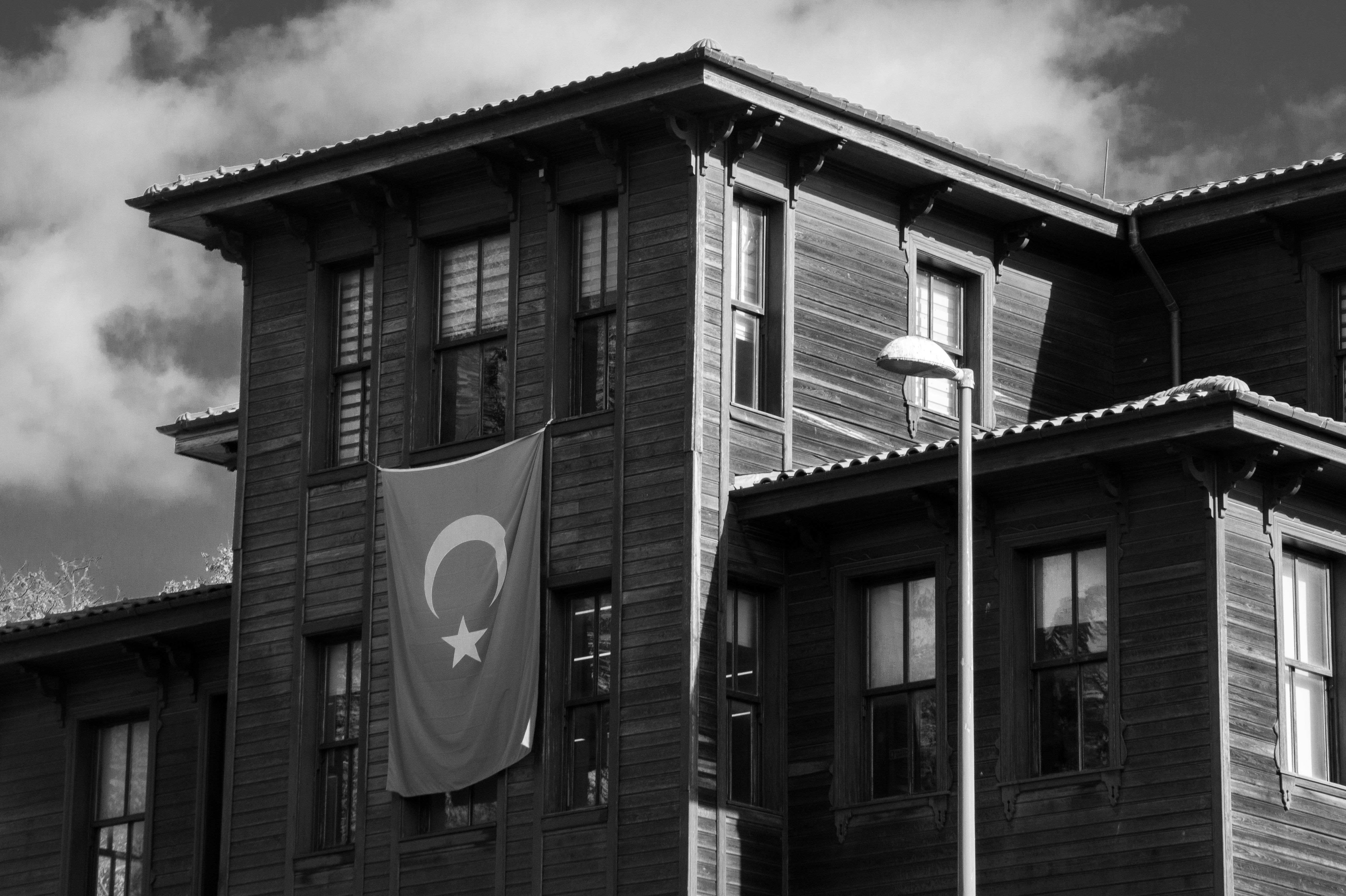 Historic Turkish Building with Flag in Black and White · Free Stock Photo