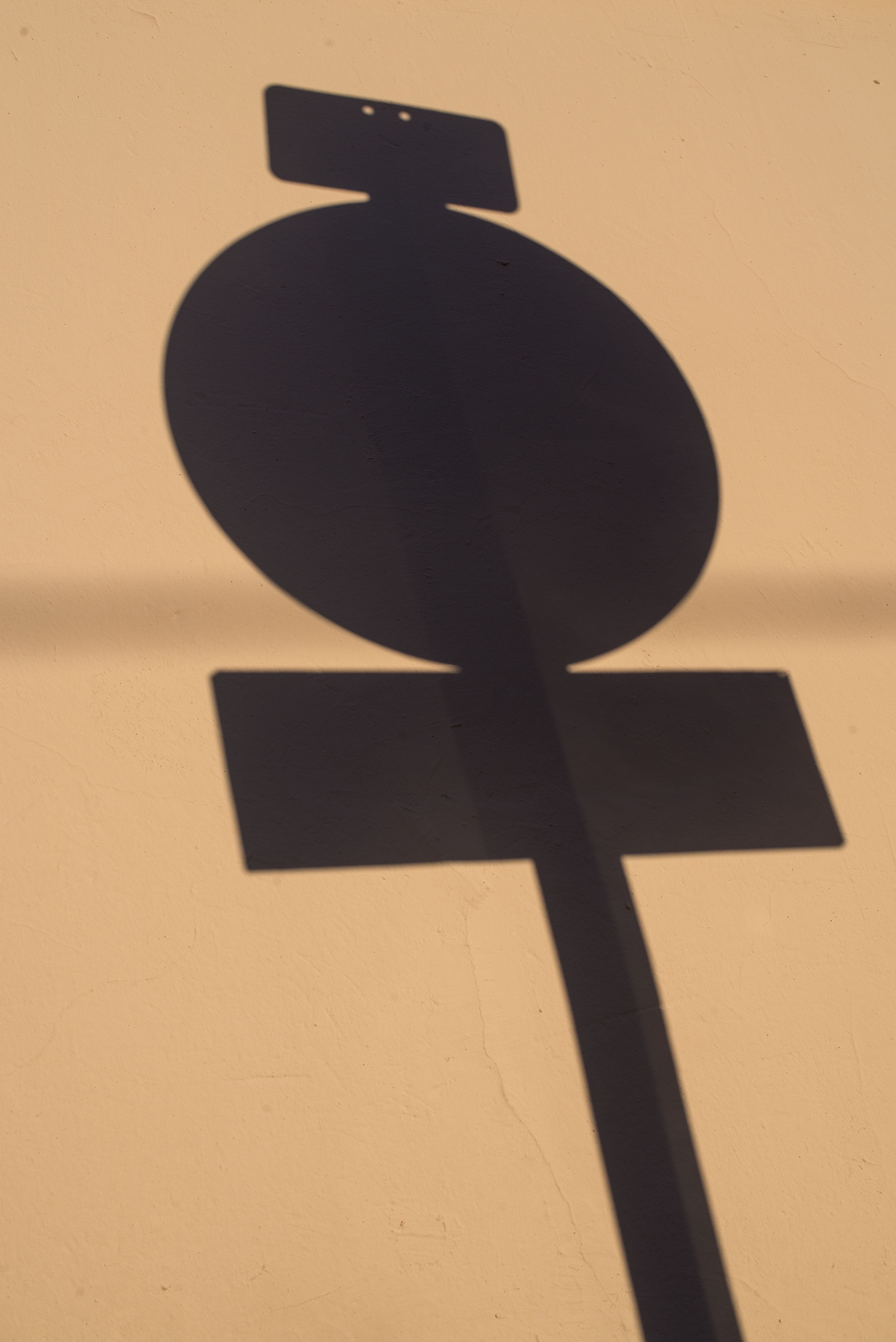 Artistic Shadow of Street Sign on Wall · Free Stock Photo