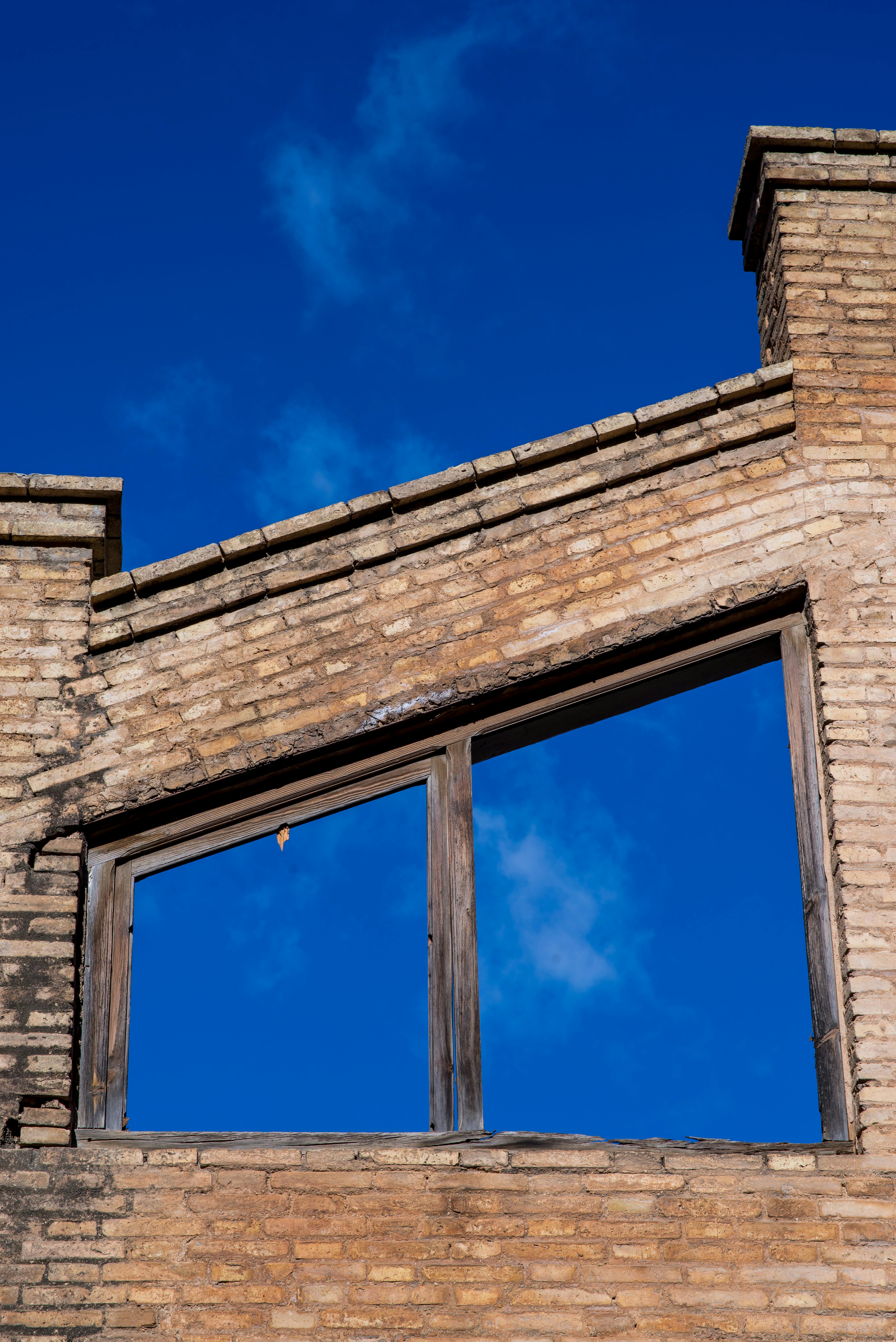 Old Brick Building with Empty Window Frame · Free Stock Photo