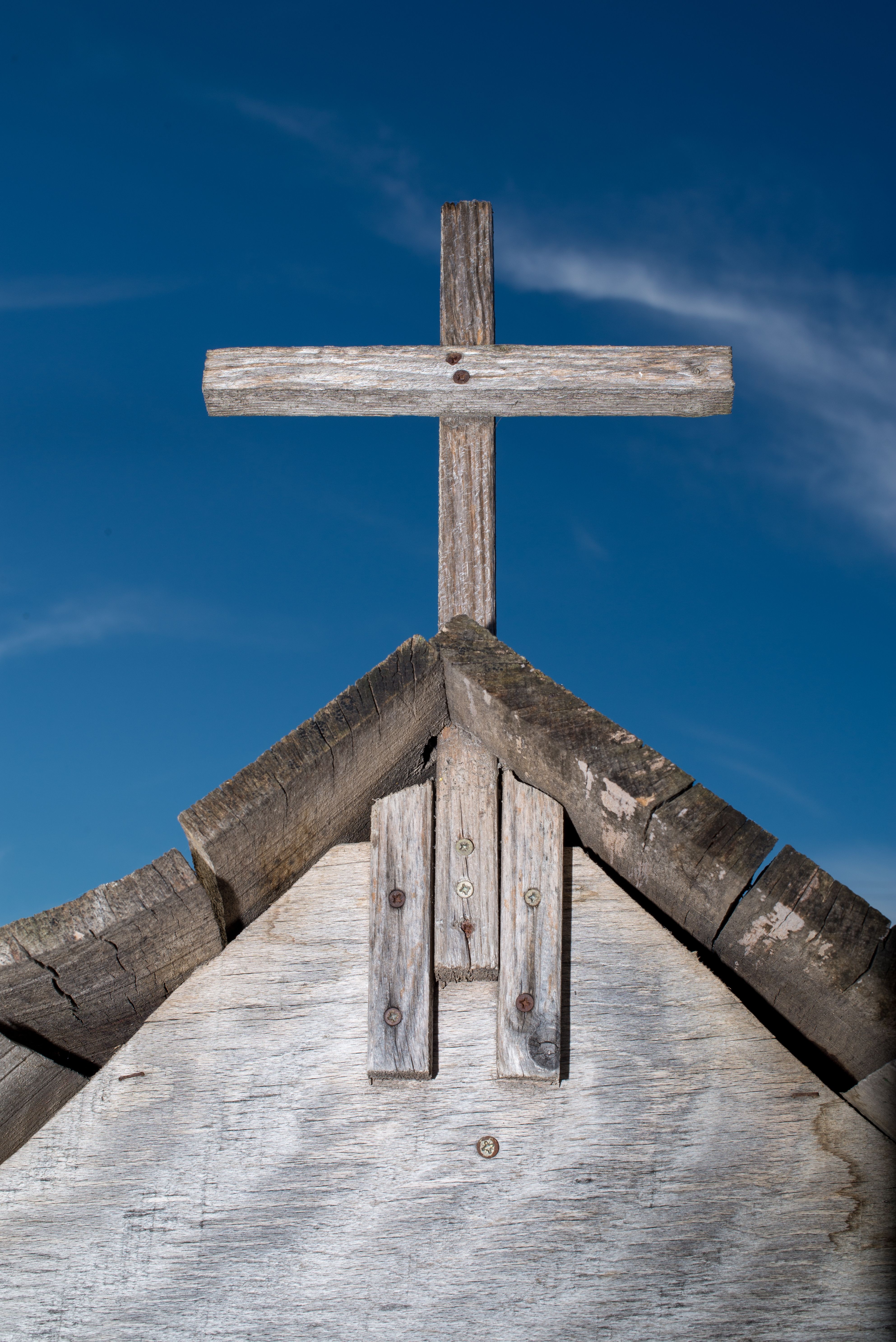 Weathered Wooden Cross Against Blue Sky · Free Stock Photo