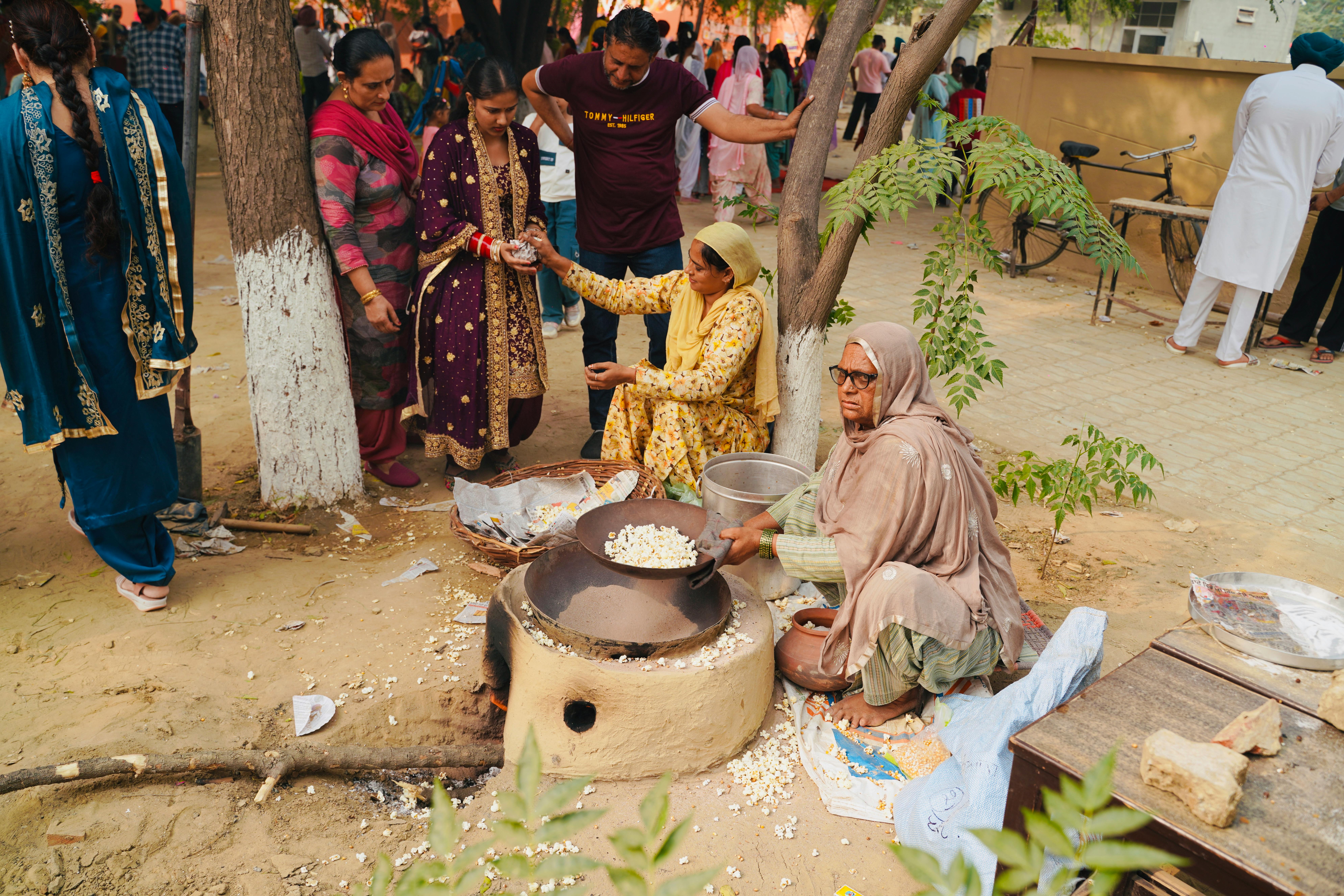 Outdoor Popcorn Cooking in Traditional Setting · Free Stock Photo