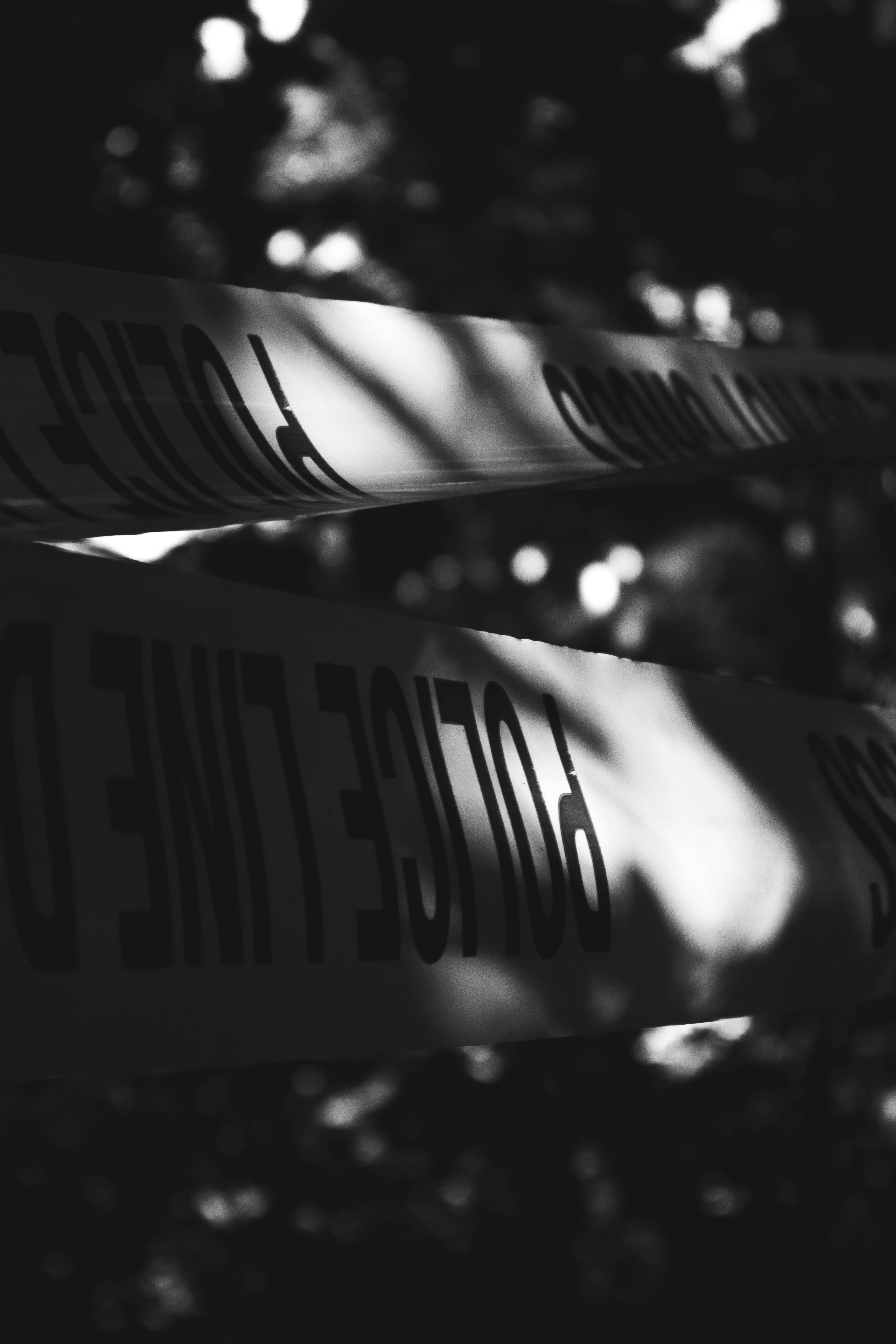 Monochrome Police Crime Scene Tape Outdoors · Free Stock Photo