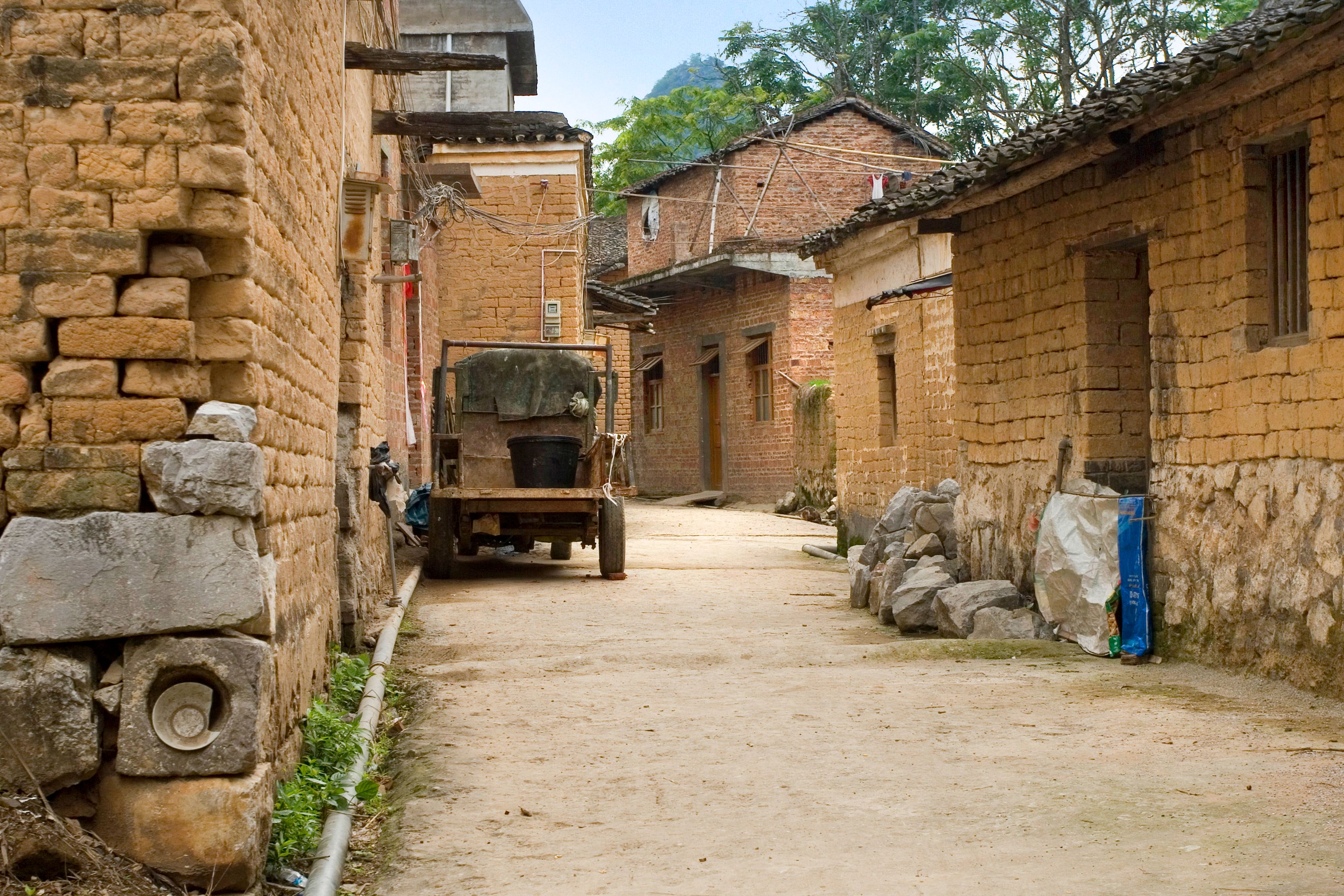 Rustic Rural Village Alley with Brick Houses · Free Stock Photo
