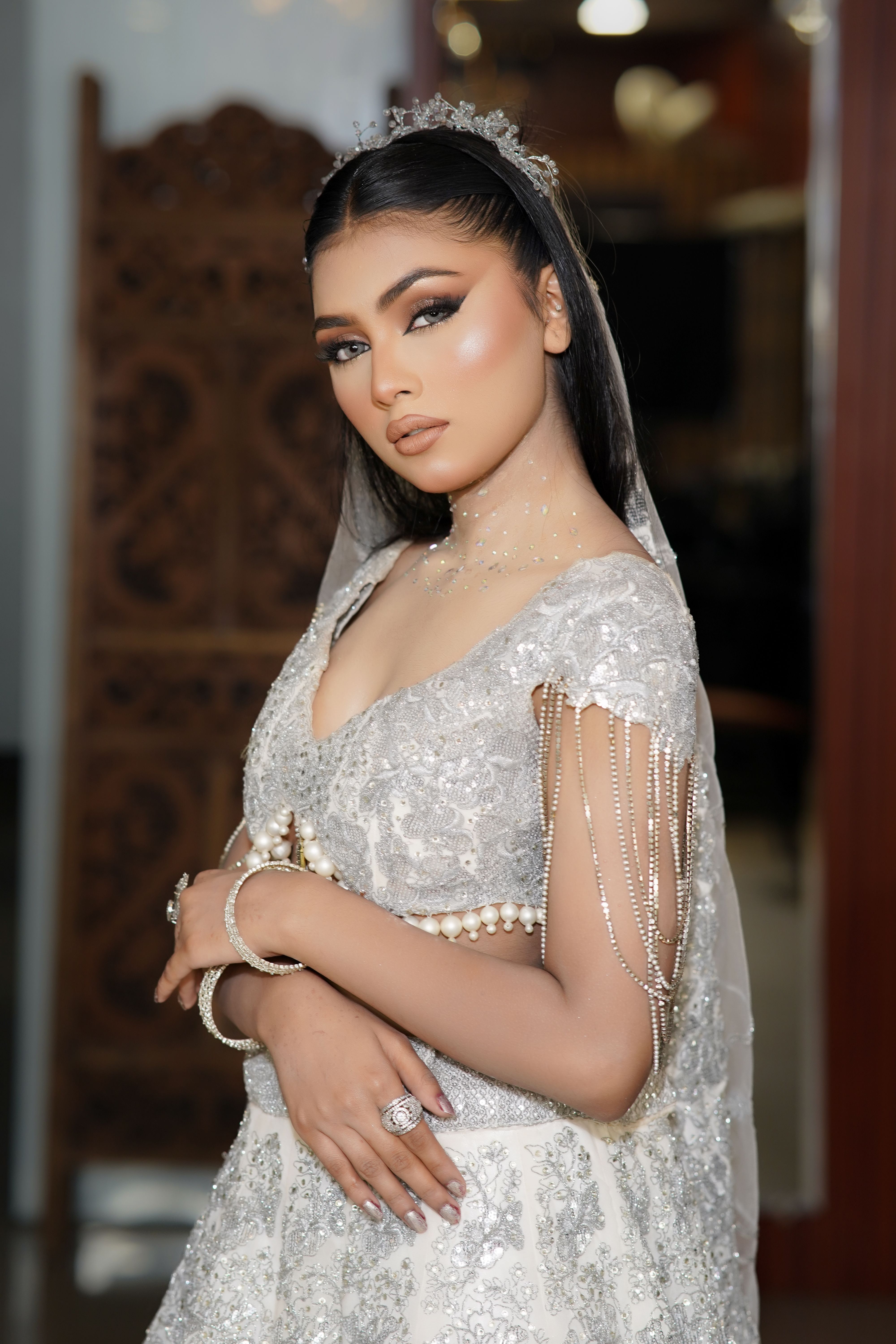 Elegant Bride Posing Indoors in Ornate Dress · Free Stock Photo