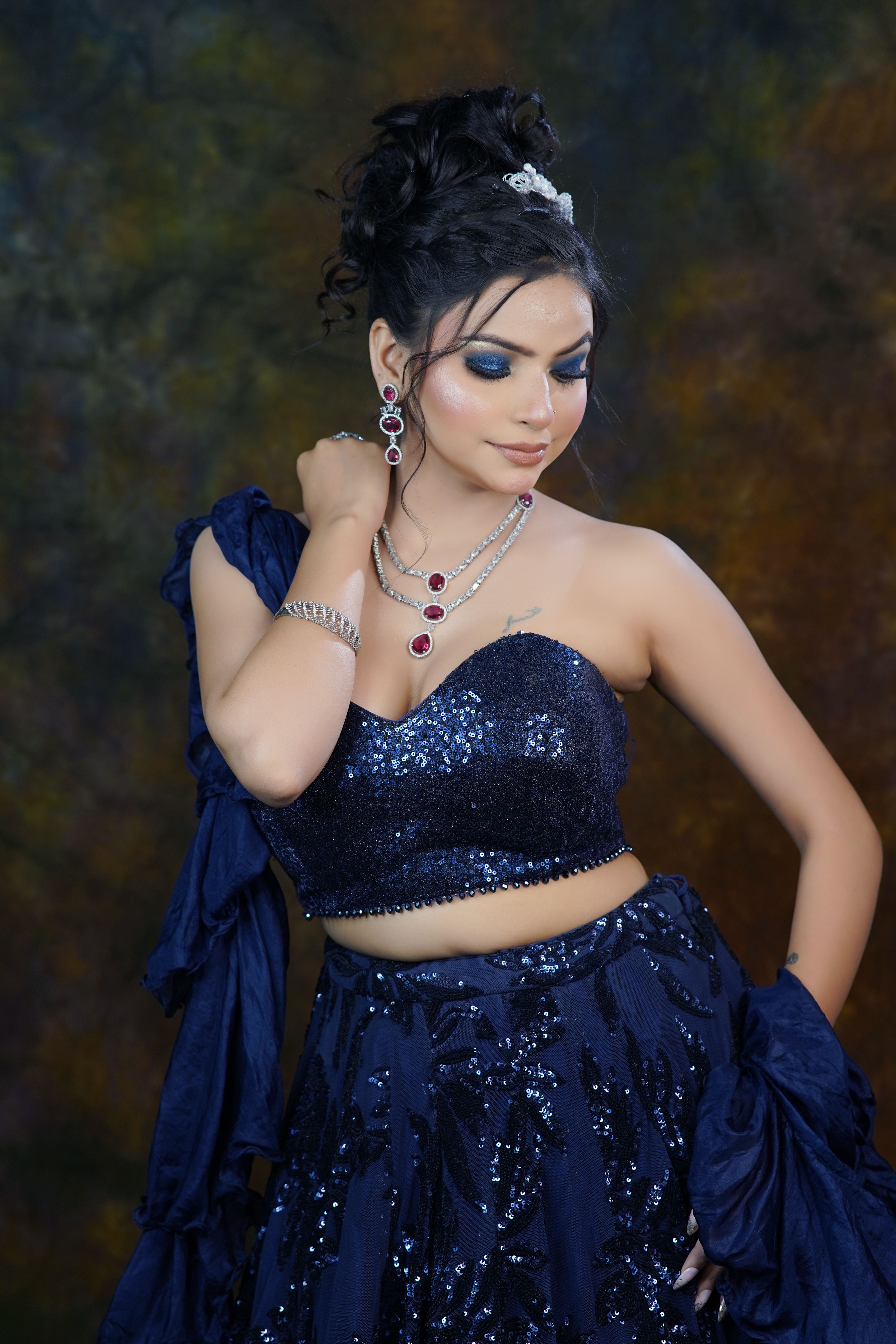 Elegant Woman in Dark Blue Sequin Dress · Free Stock Photo