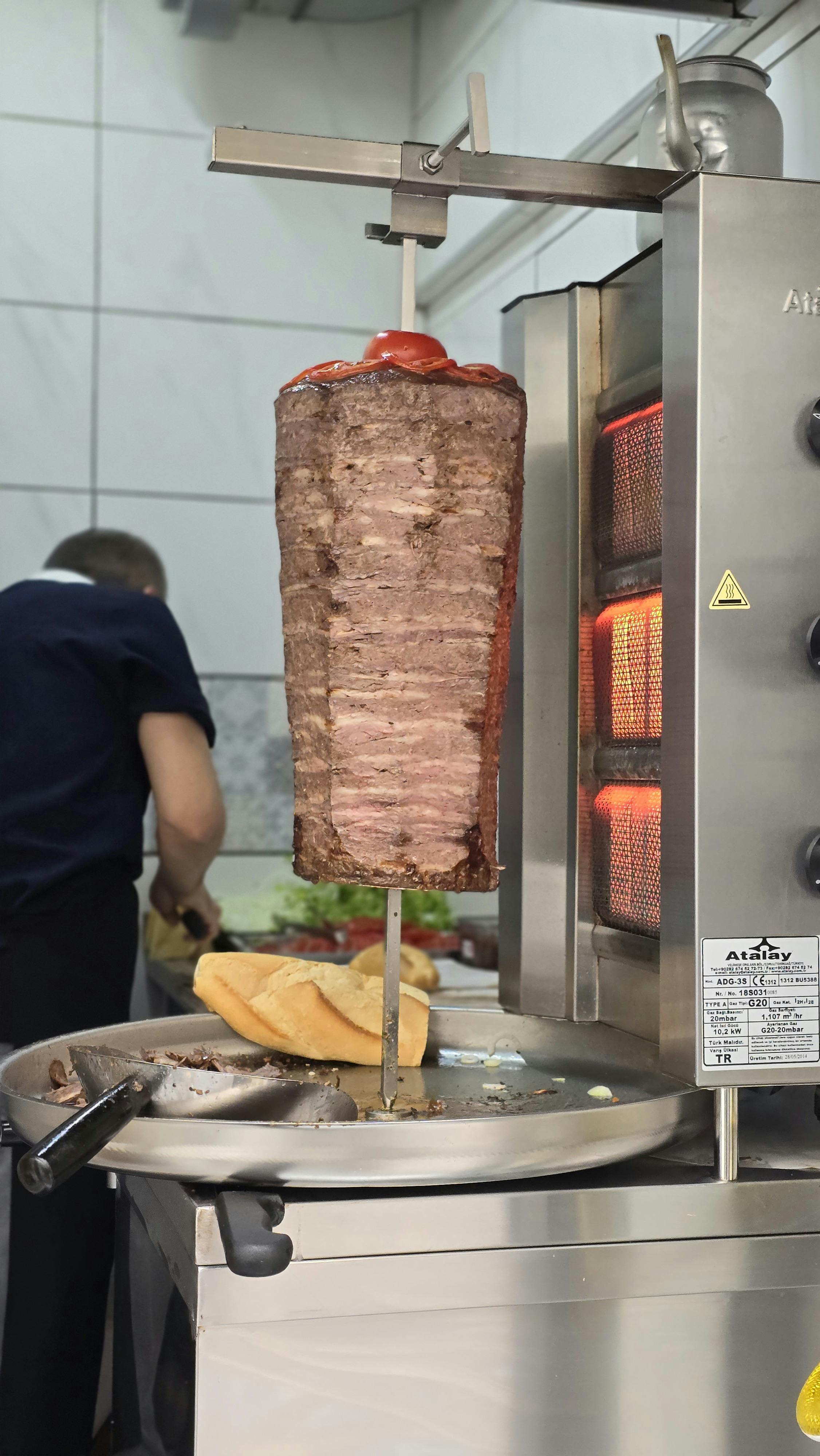 Traditional Shawarma Meat Rotating on Vertical Grill · Free Stock Photo