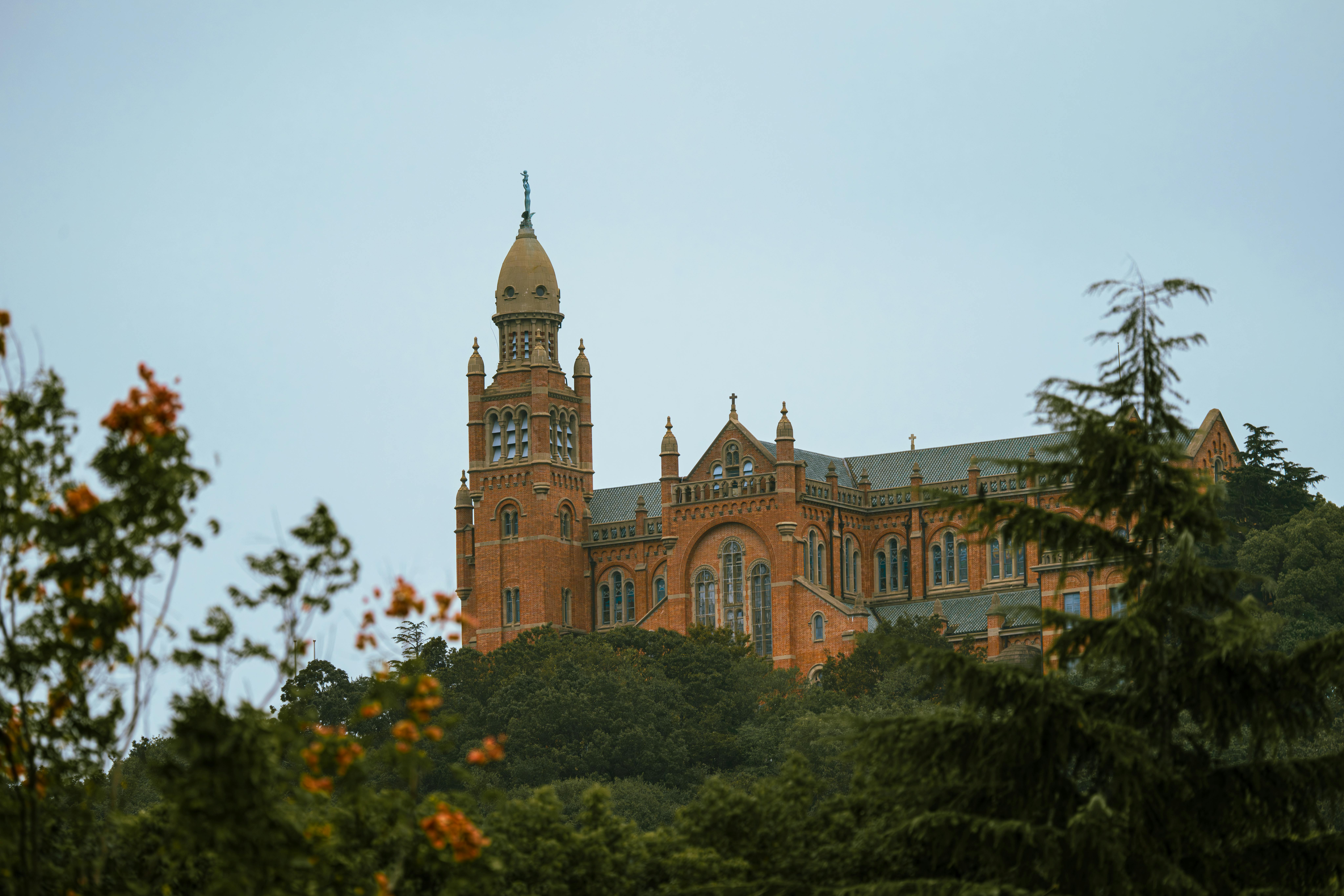 Historic European-style Brick Castle on Hilltop · Free Stock Photo