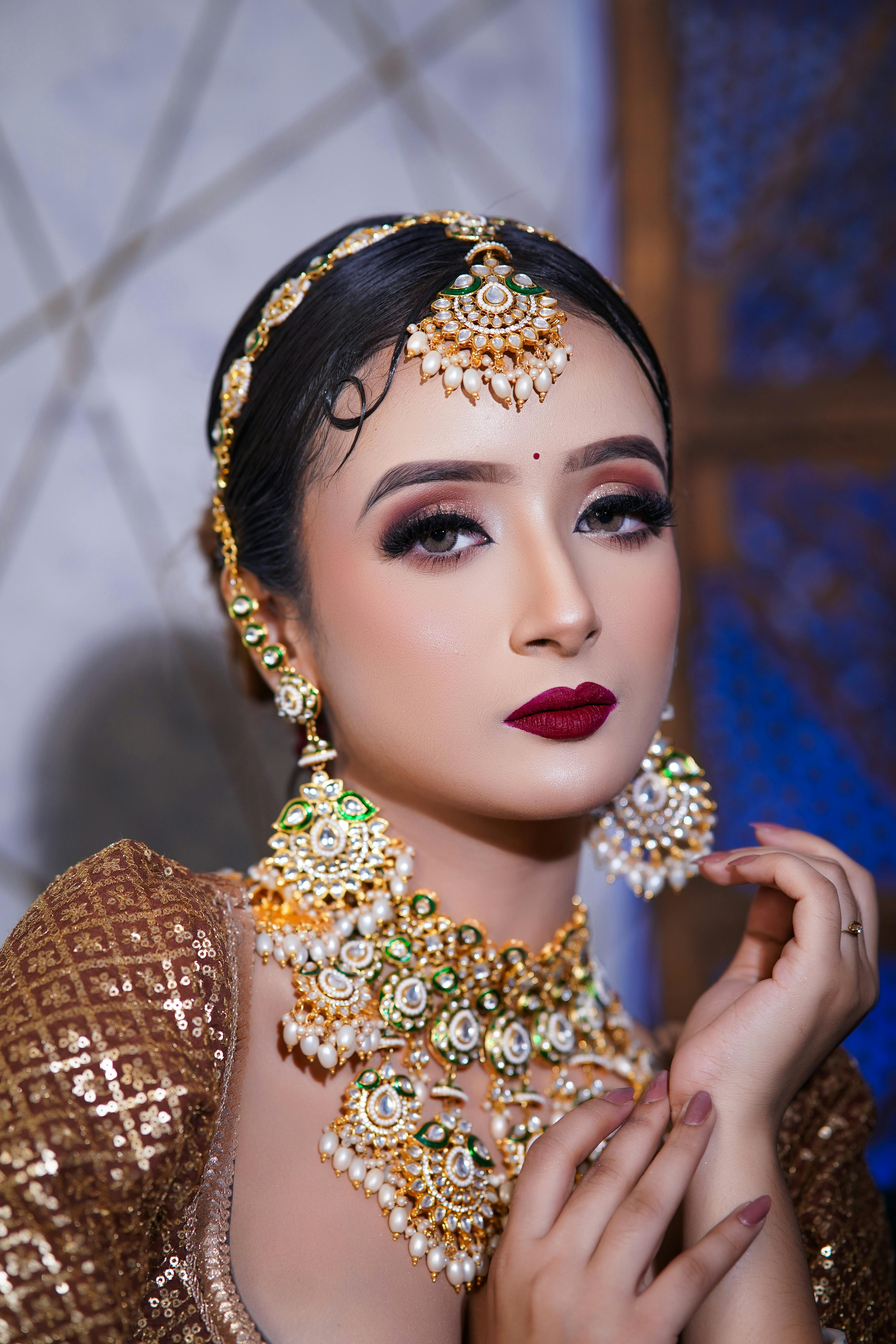 Elegant South Asian Woman in Traditional Jewelry · Free Stock Photo