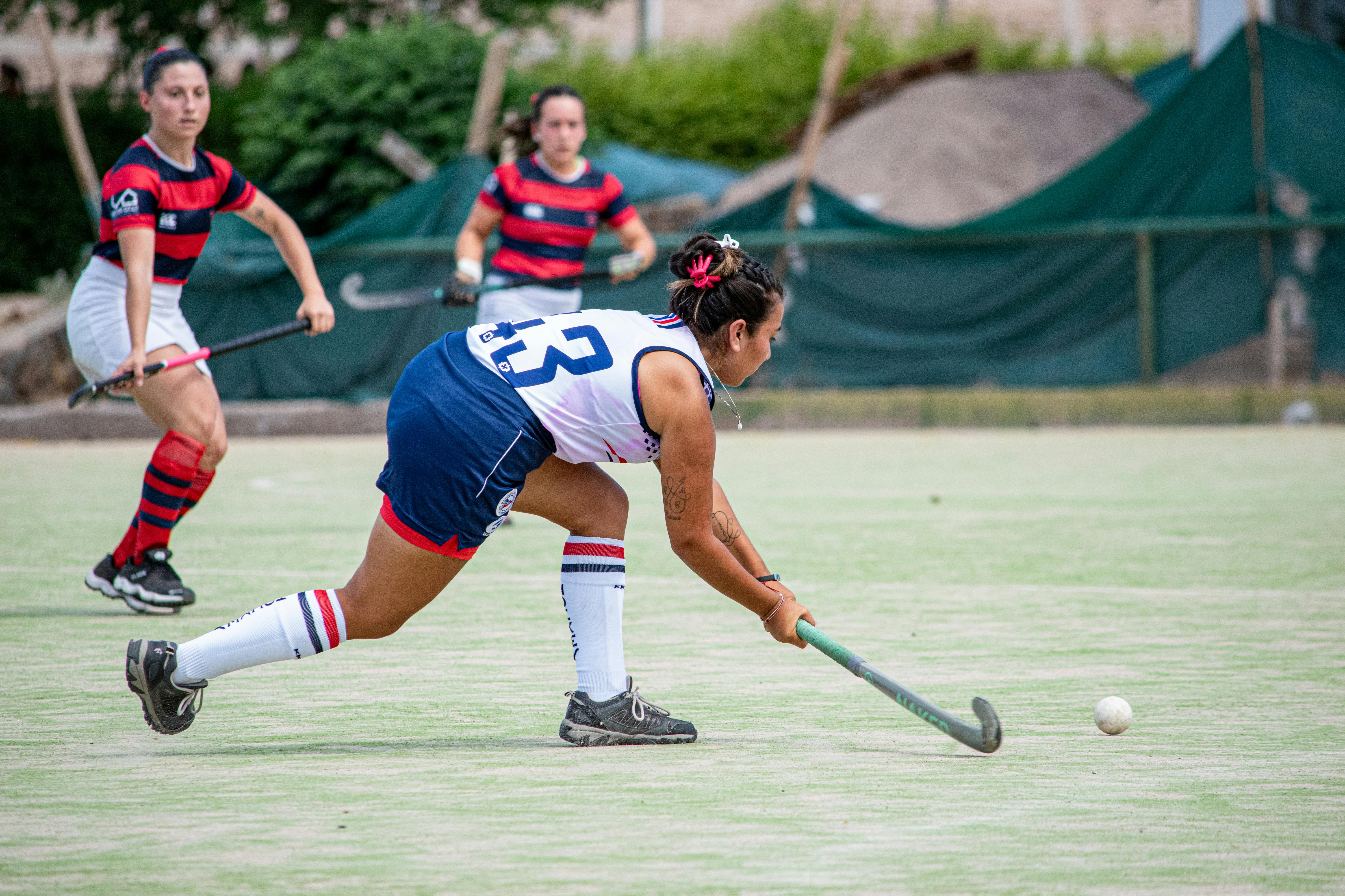 Exciting Women's Field Hockey Match Action Shot · Free Stock Photo