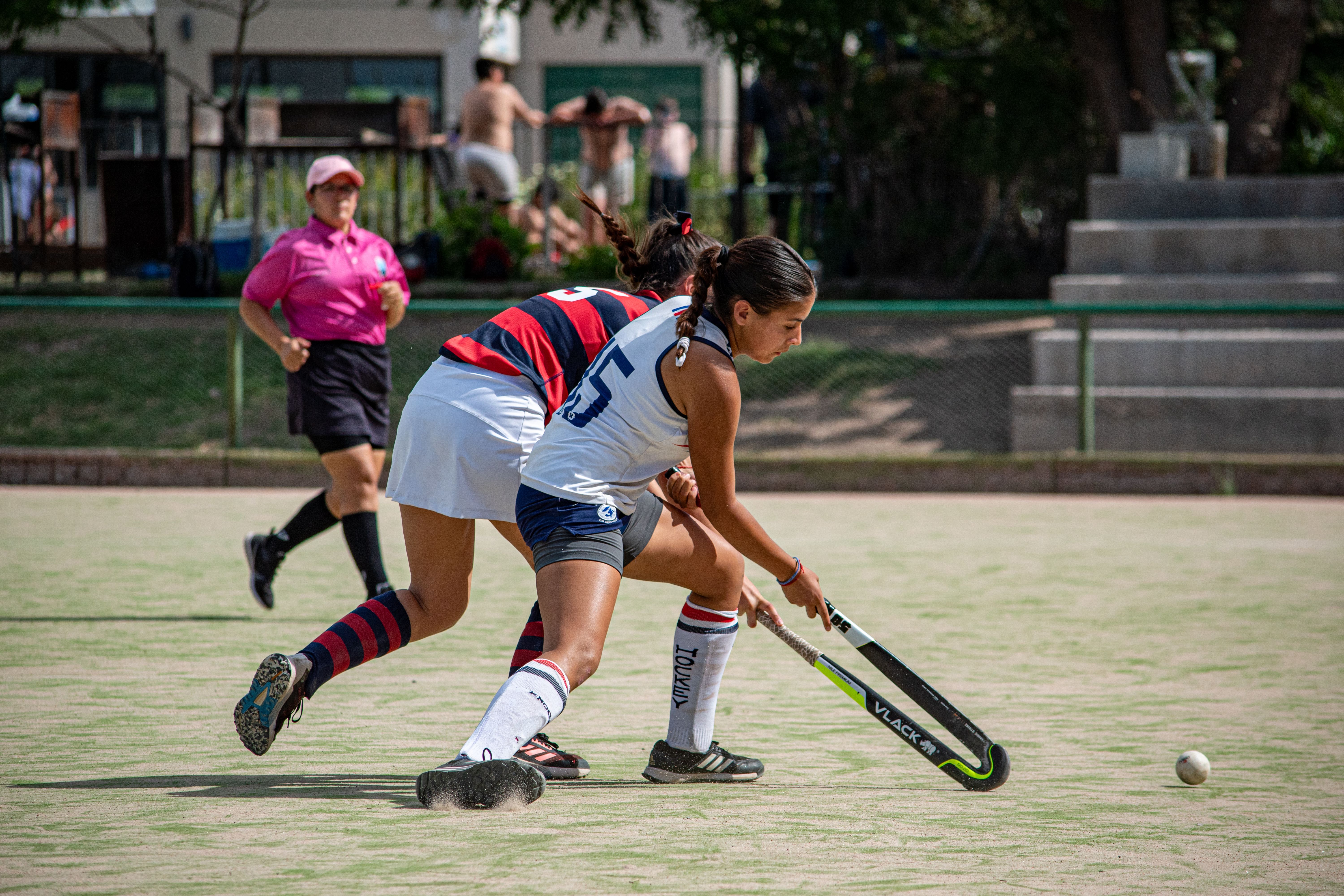 Girls Playing Field Hockey in Competitive Match · Free Stock Photo