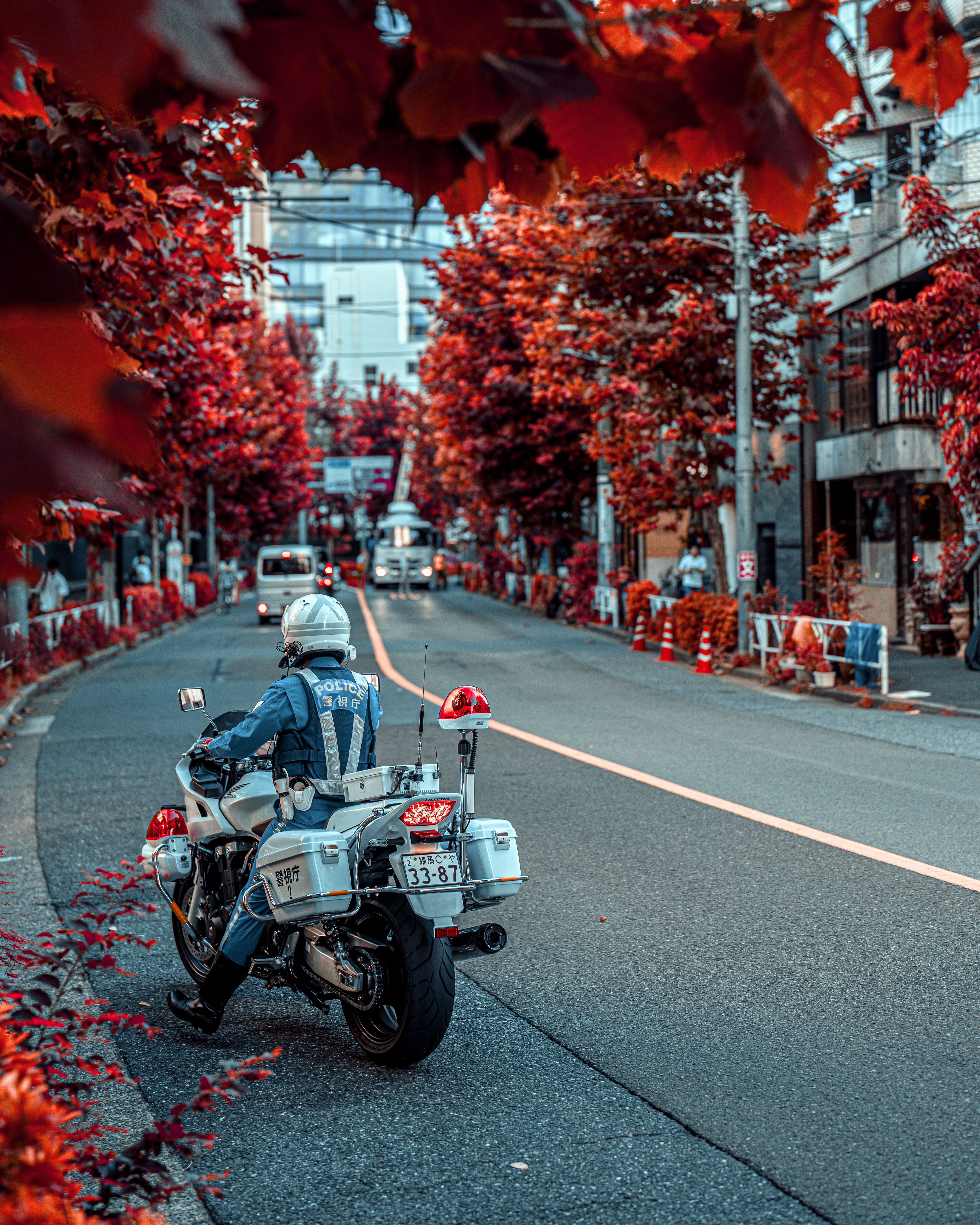 Tokyo Street Scene with Traffic Officer on Motorcycle · Free Stock Photo
