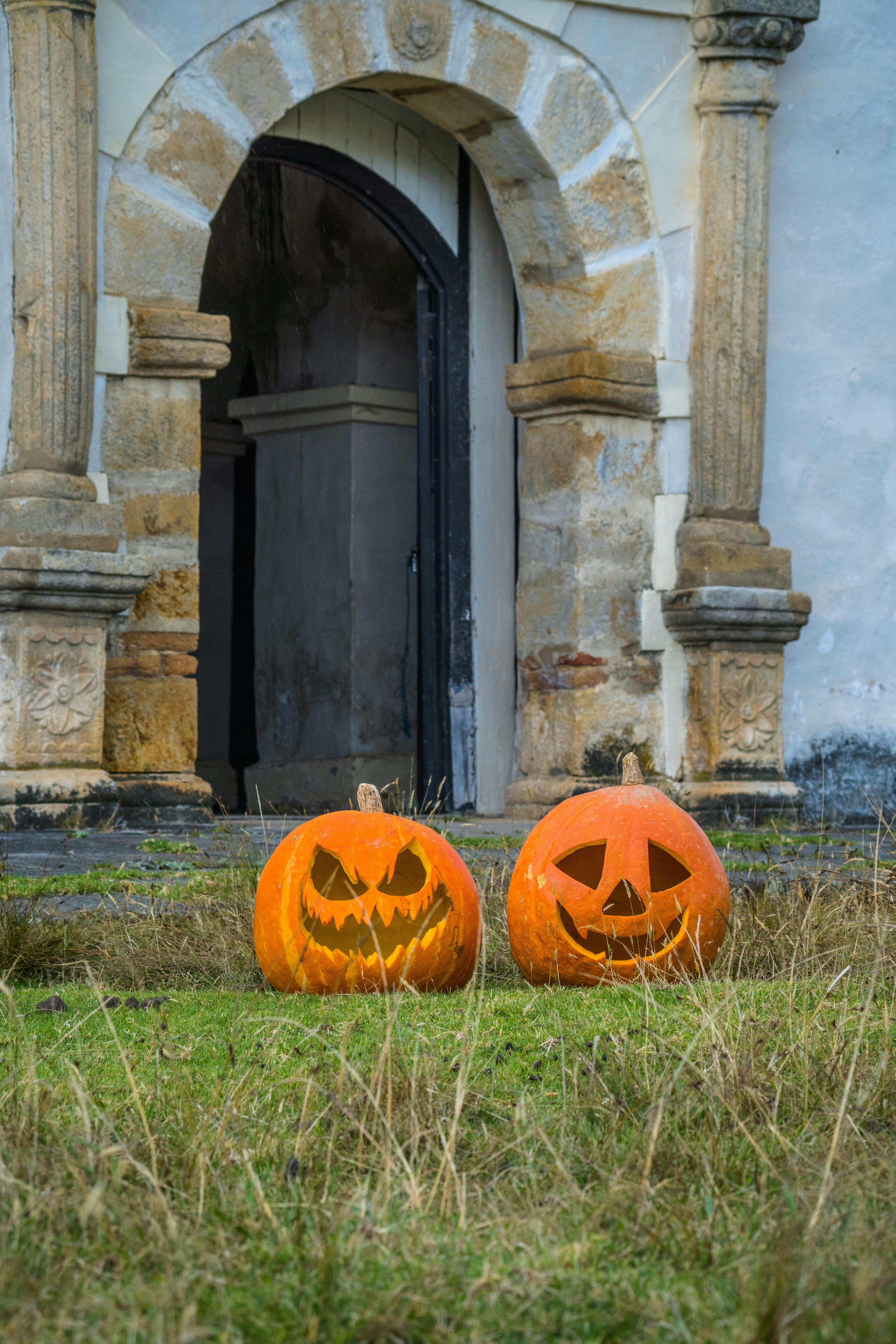 Carved Pumpkins at Historical Stone Archway · Free Stock Photo
