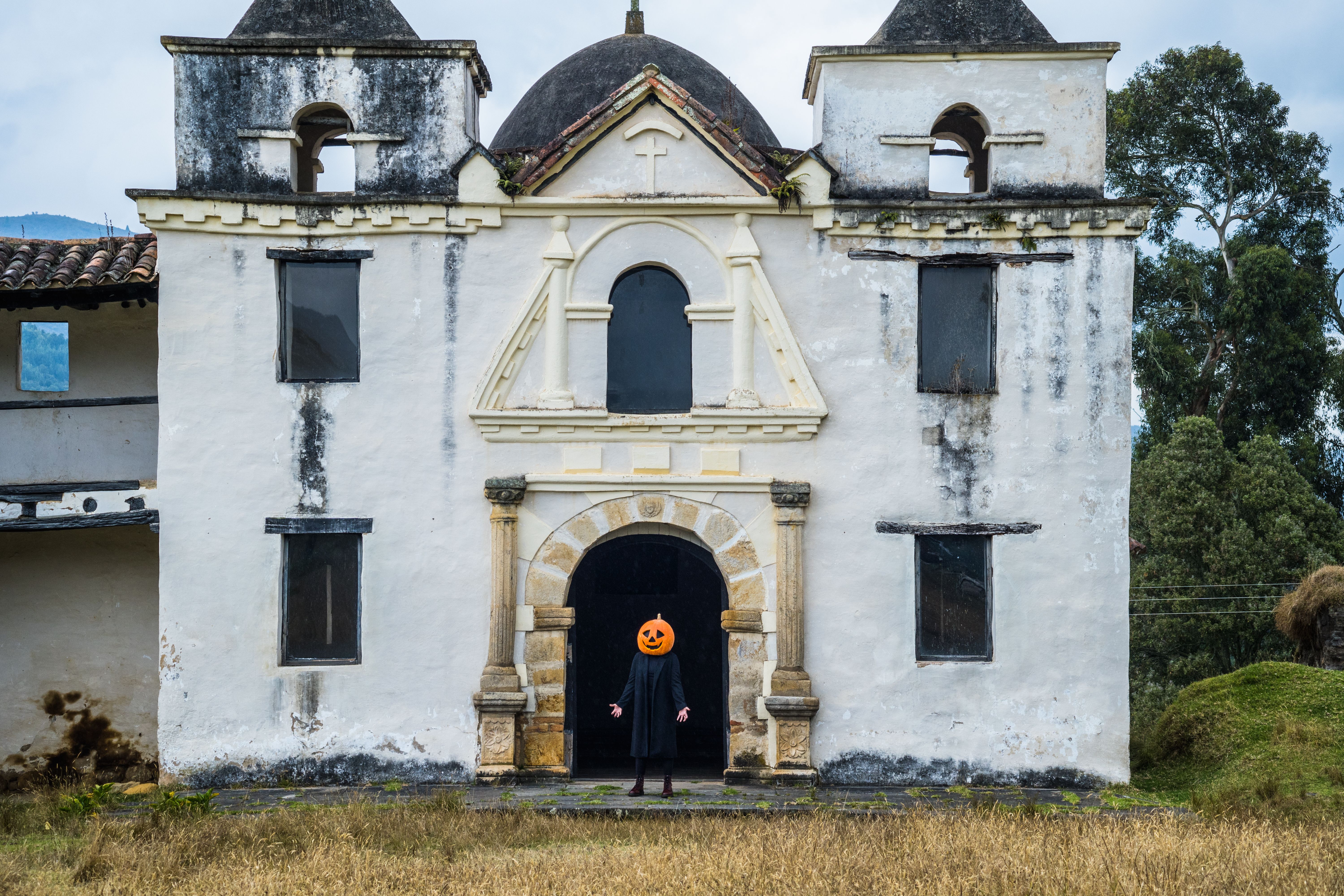 Mysterious Pumpkin-Headed Figure in Front of Abandoned Church · Free ...