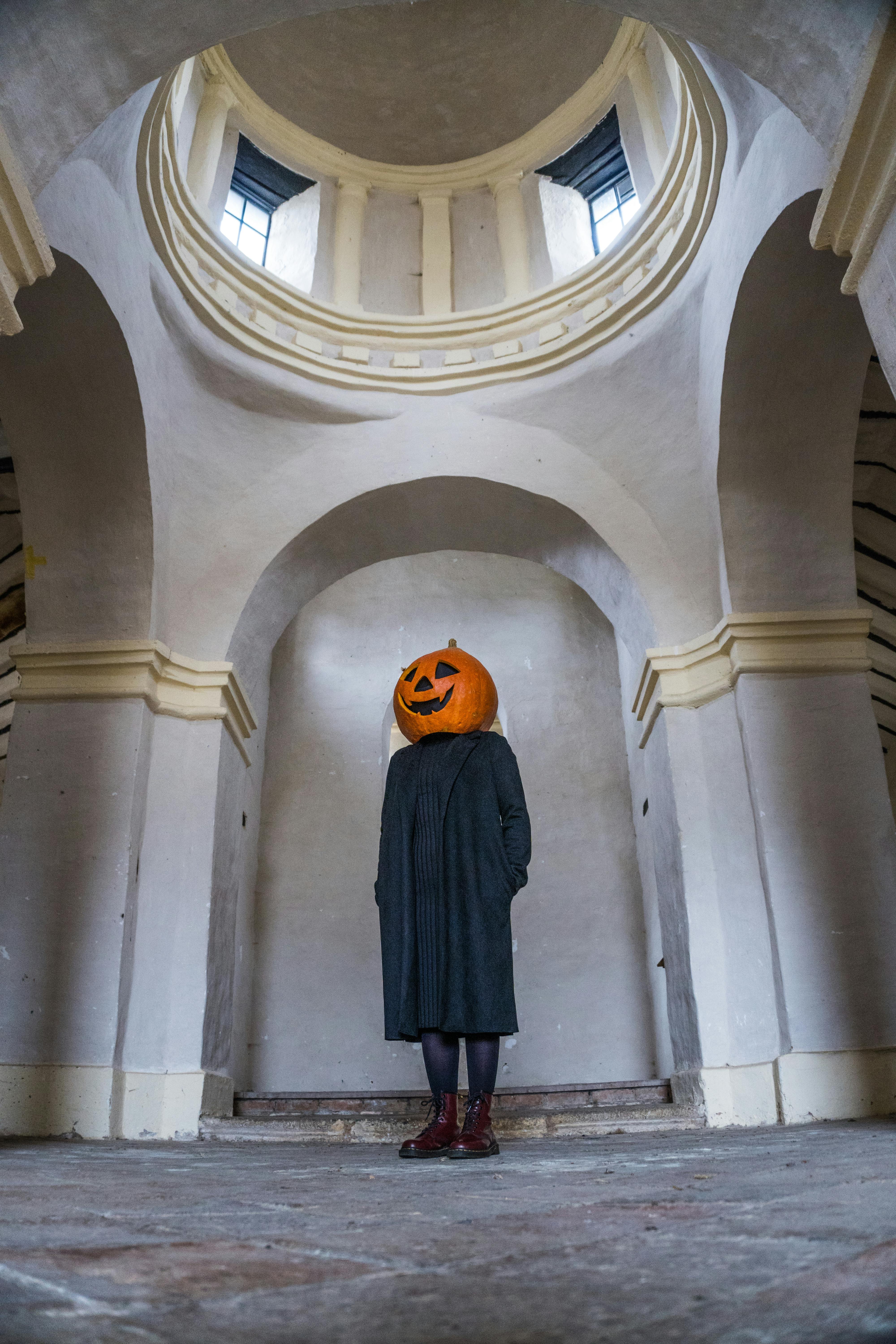 Mysterious Pumpkin Head in Historic Architecture · Free Stock Photo