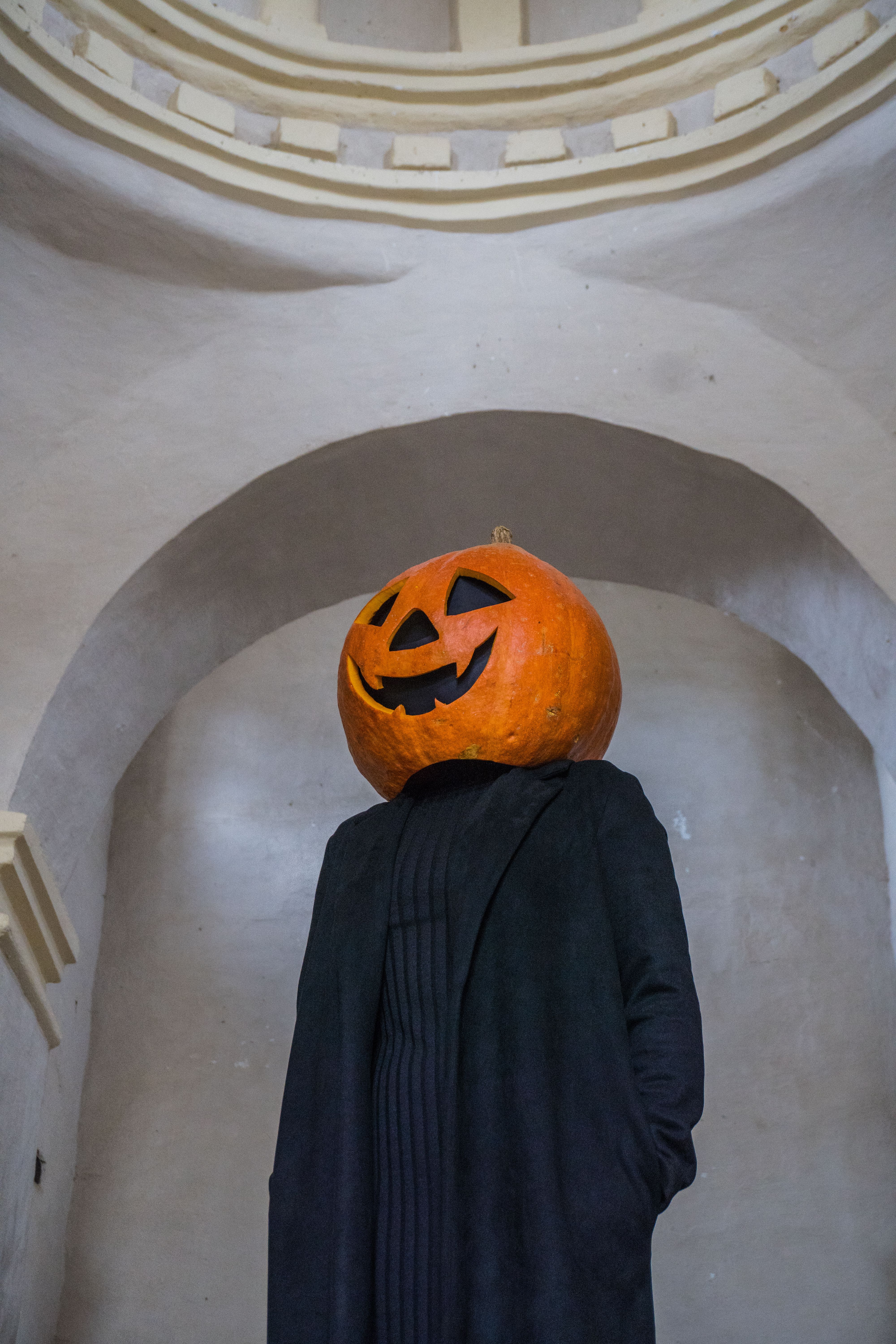 Eerie Pumpkin-Headed Costume in Gothic Setting · Free Stock Photo