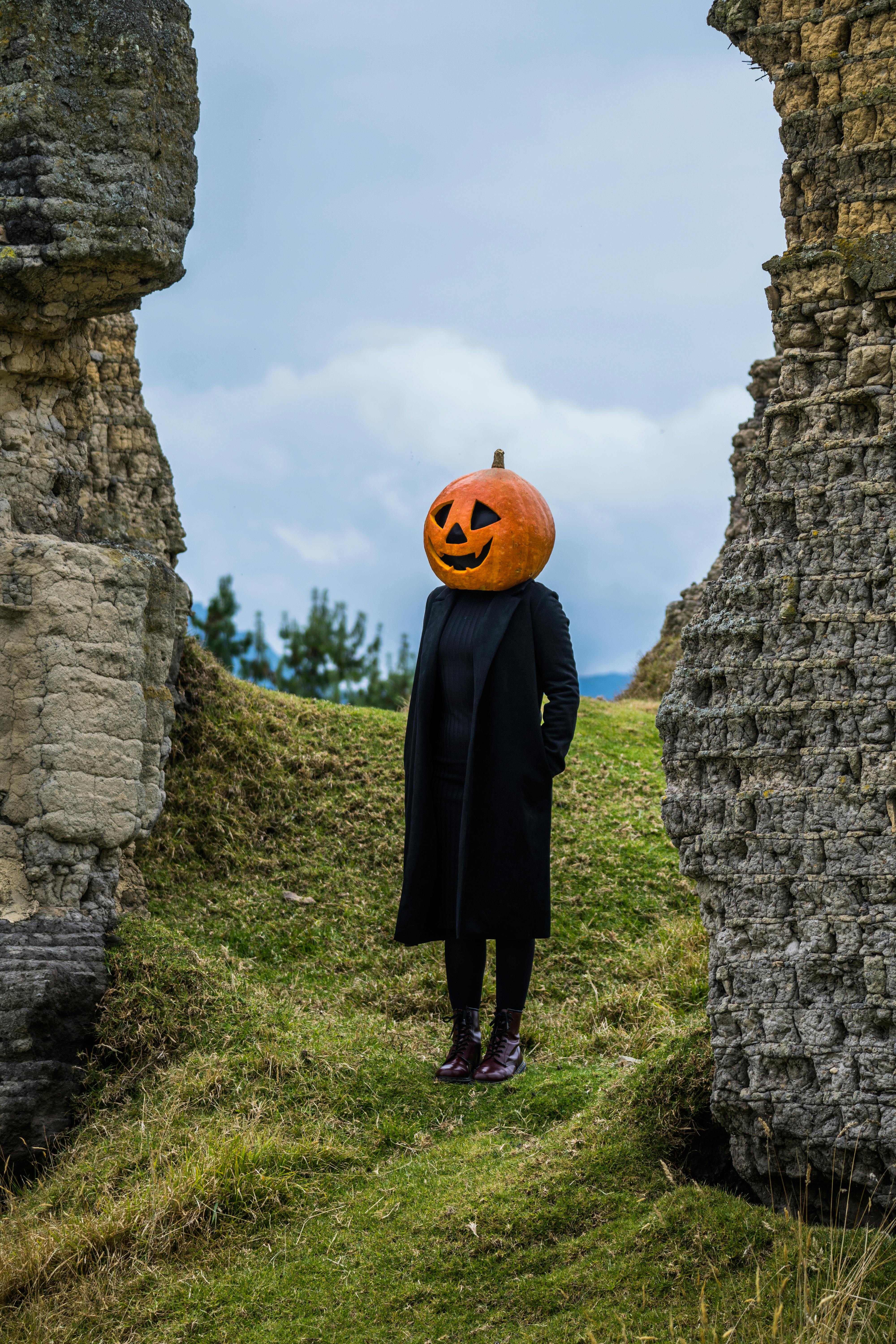 Pumpkin Head in Ruins: A Spooky Halloween Scene · Free Stock Photo