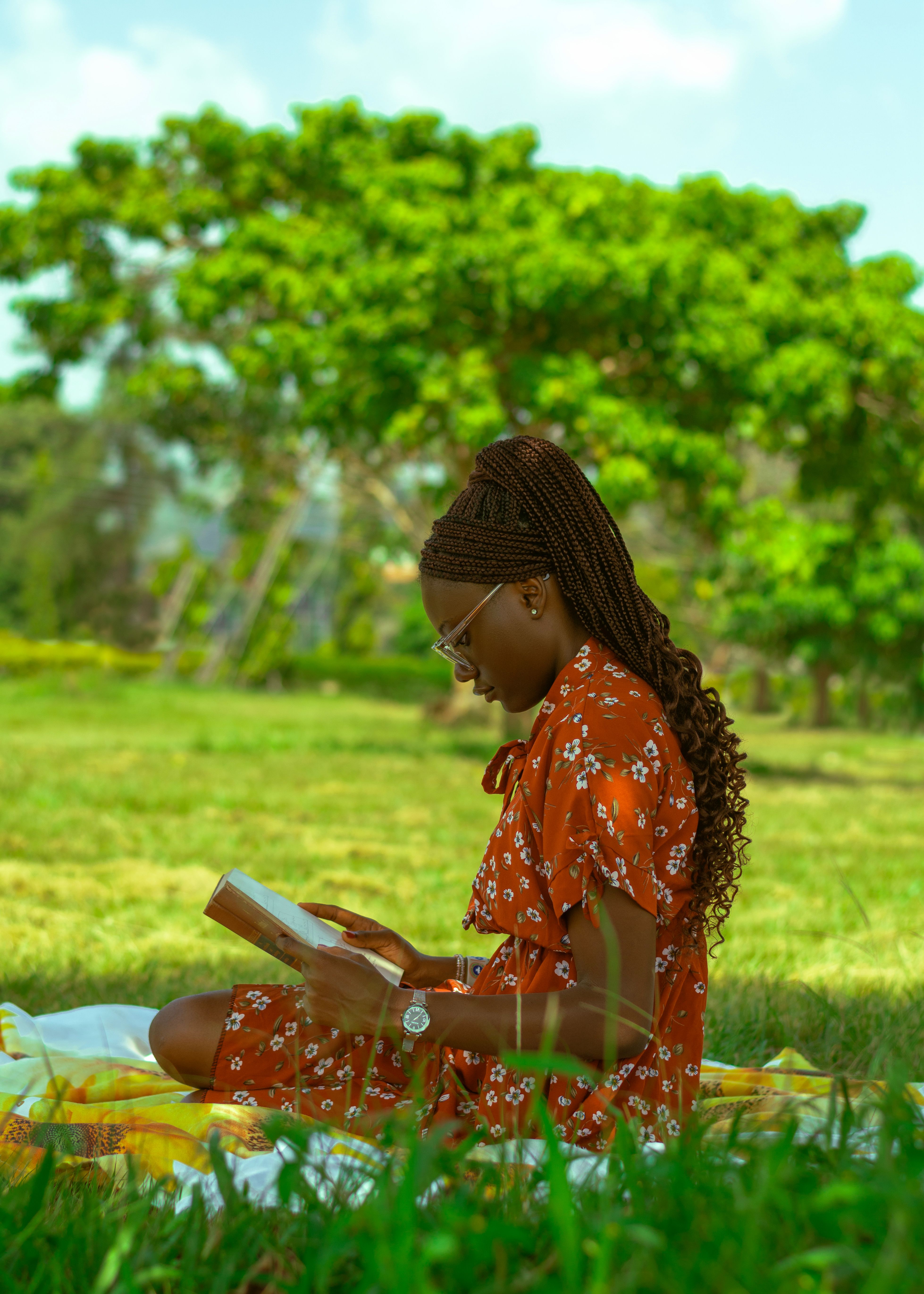 African Woman Reading Outdoors in Ado Ekiti · Free Stock Photo