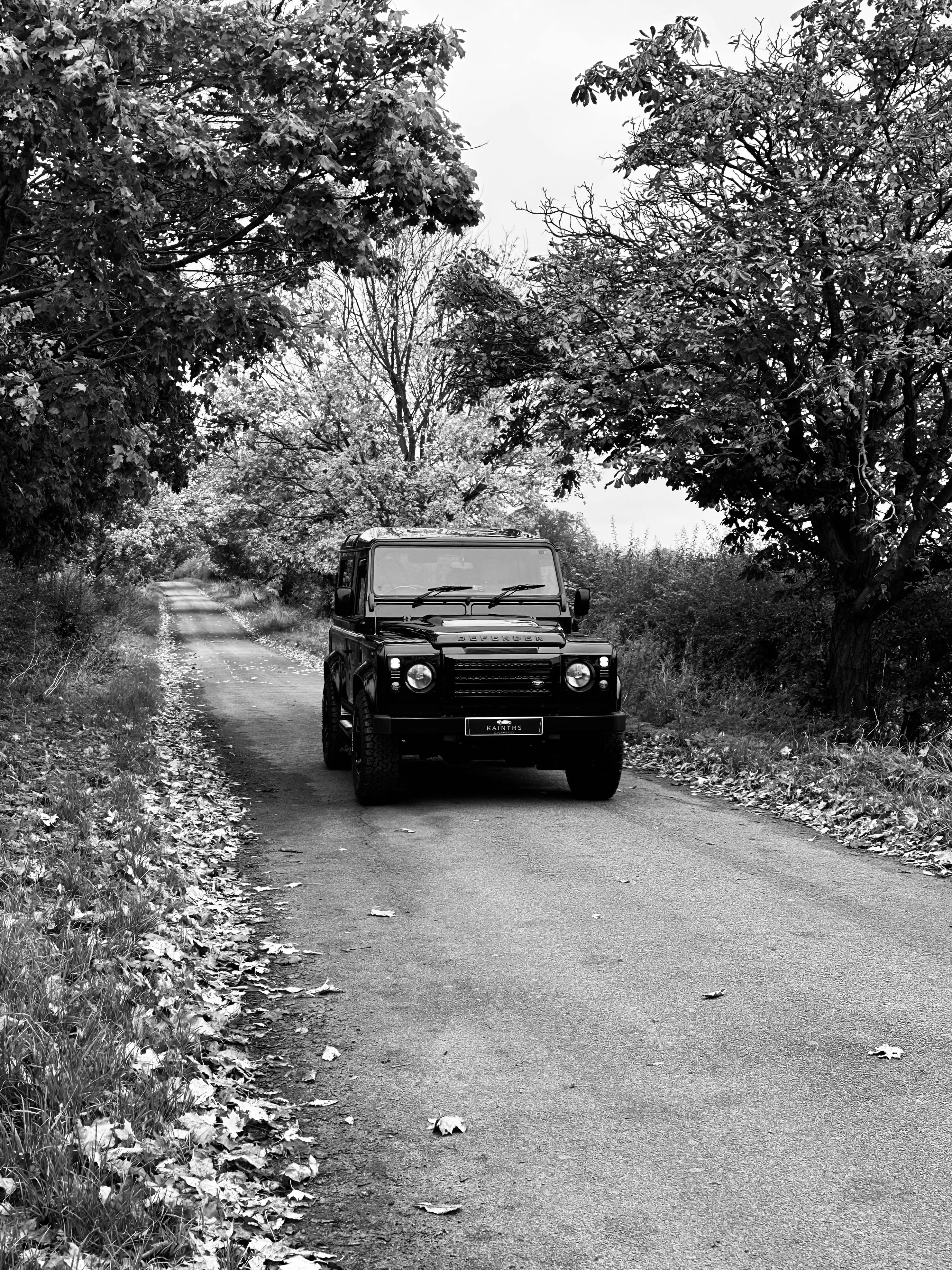 Classic Land Rover on a Scenic Country Road · Free Stock Photo