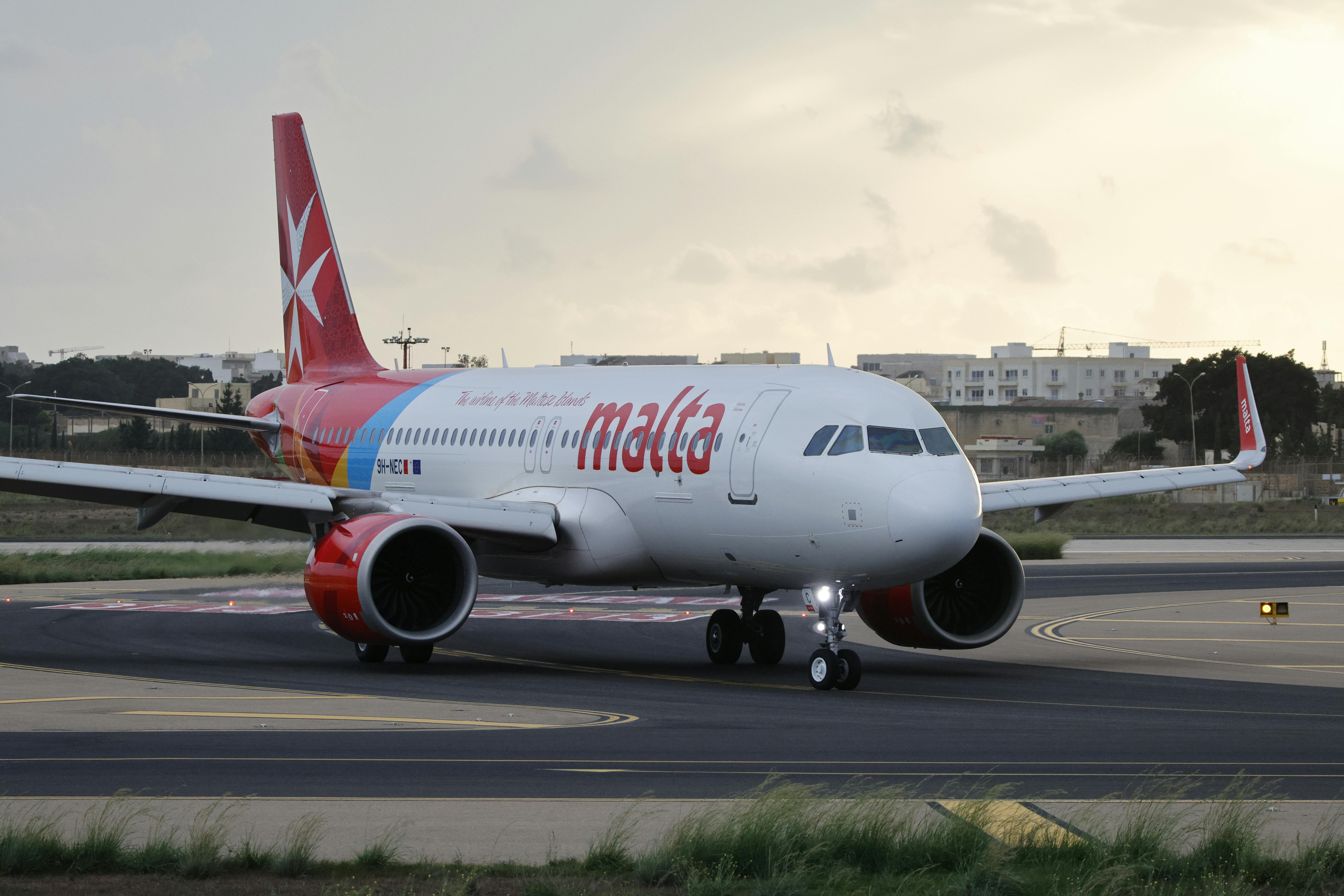 Air Malta Airbus A320 on Runway at Dusk · Free Stock Photo