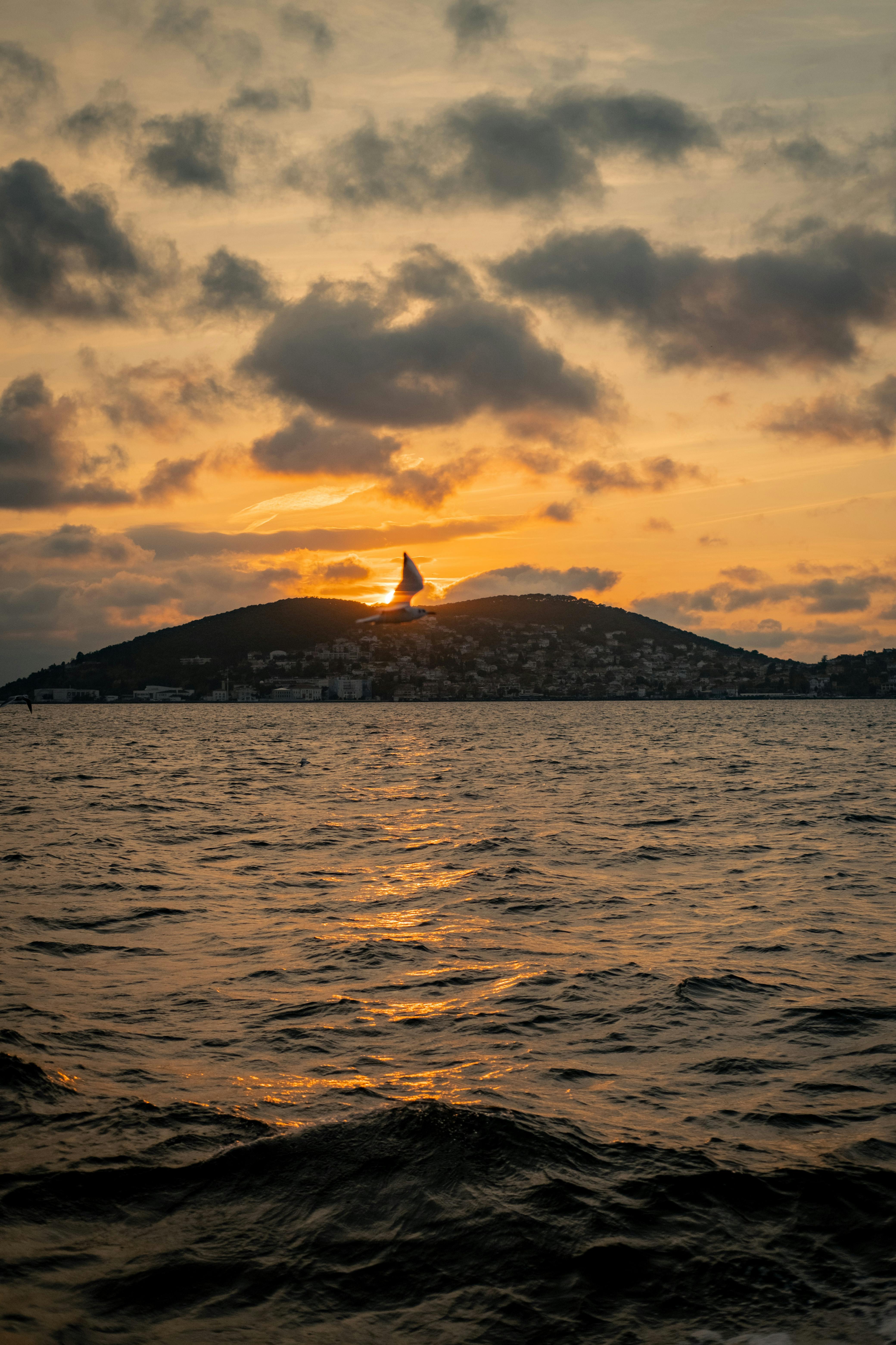 Dramatic Sunset Over Coastal Island Scene · Free Stock Photo