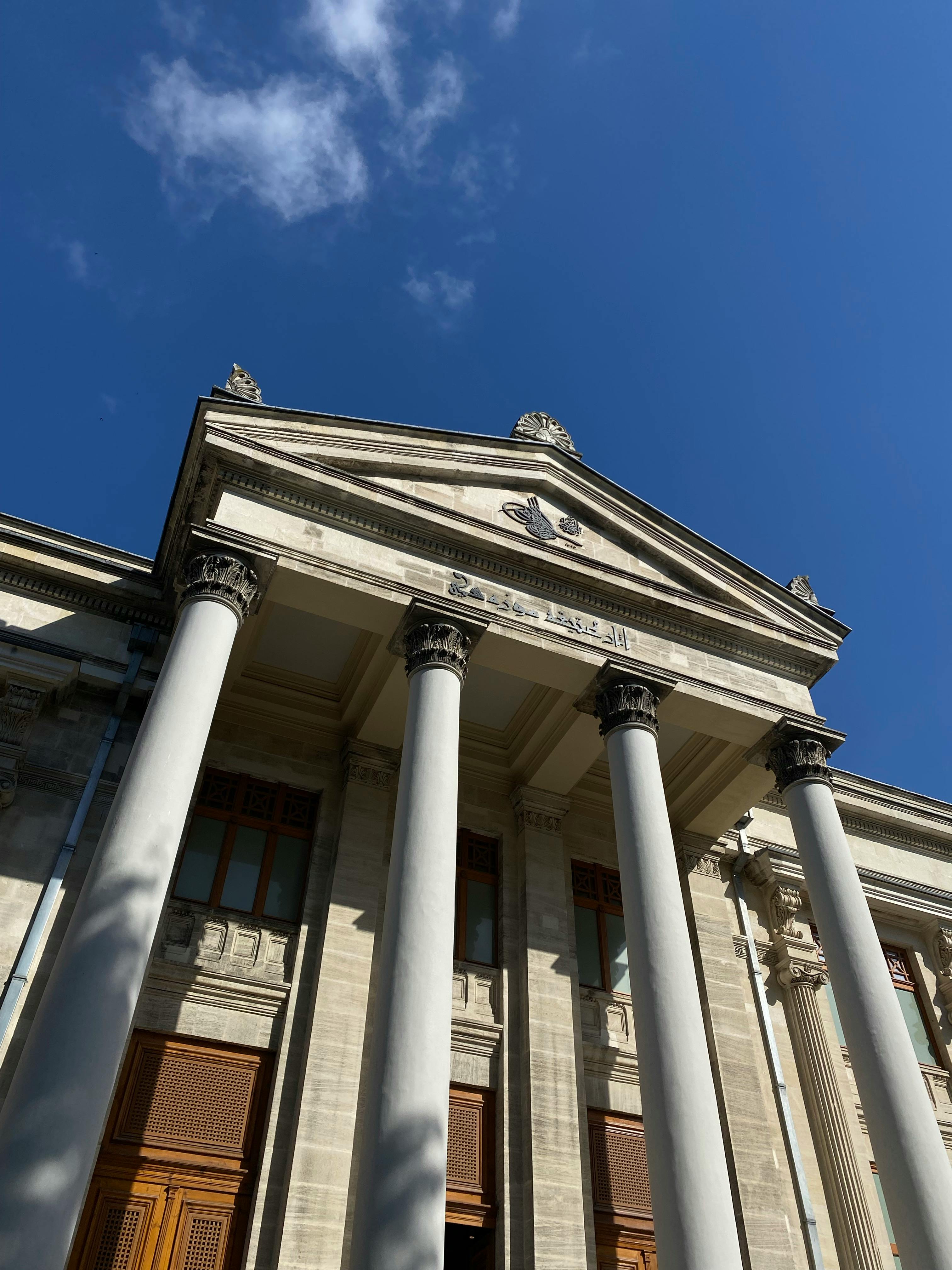 Grand Neoclassical Building Facade Under Blue Sky · Free Stock Photo