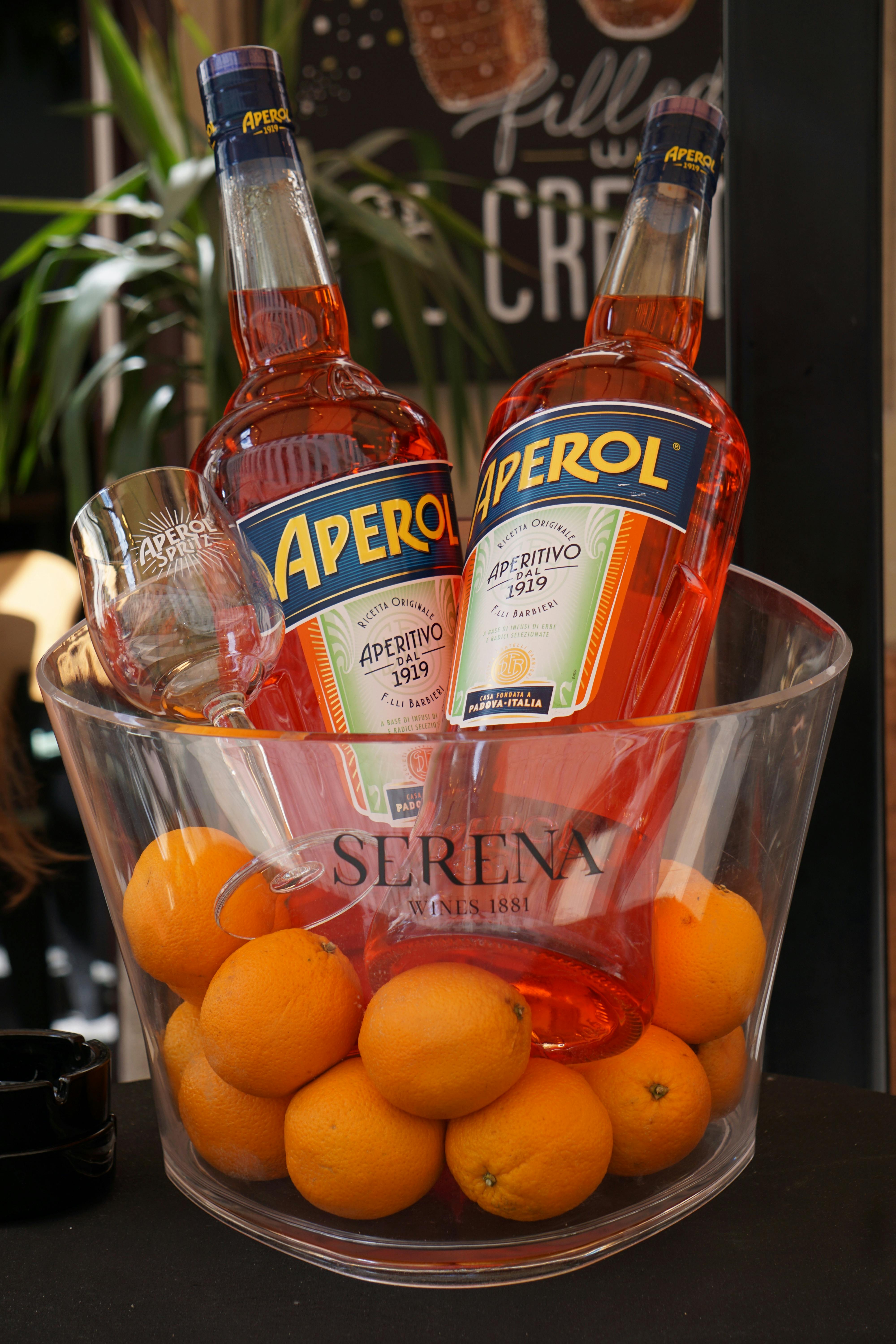 Aperol Aperitivo Bottles in Chilled Orange Bucket · Free Stock Photo