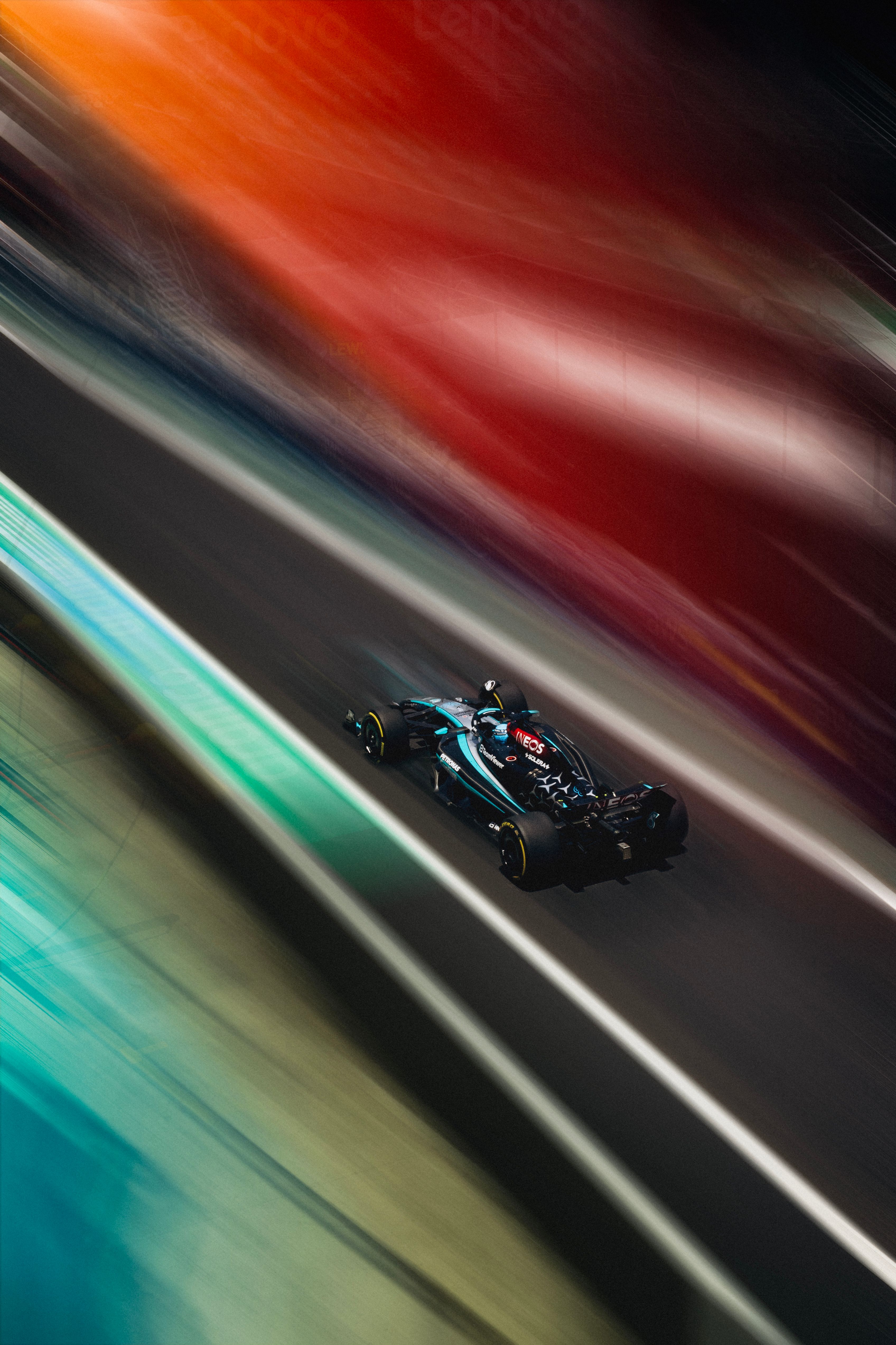 High-Speed Race Car on a Vibrant Track · Free Stock Photo