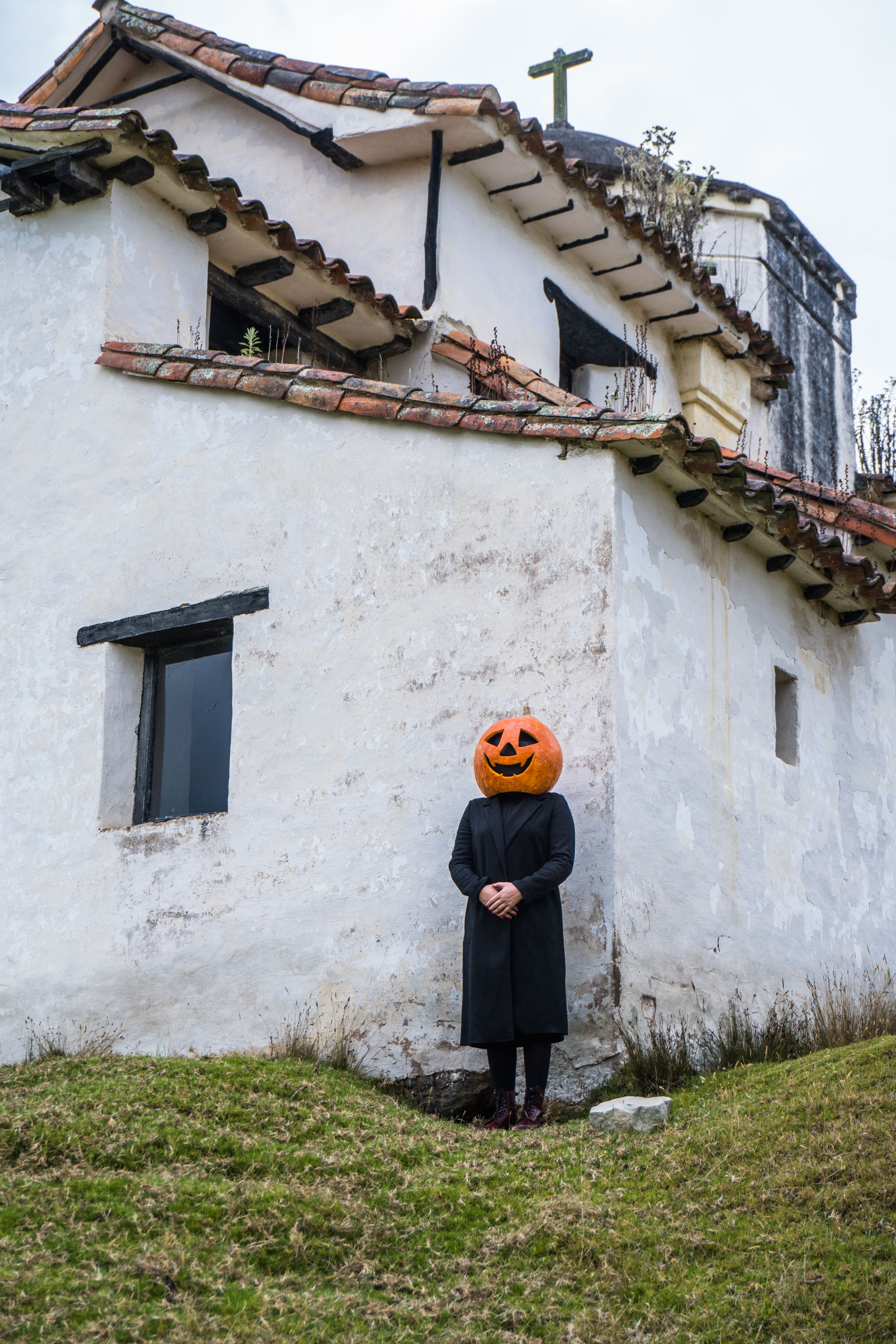 Person with Pumpkin Head by Rustic Building in Colombia · Free Stock Photo