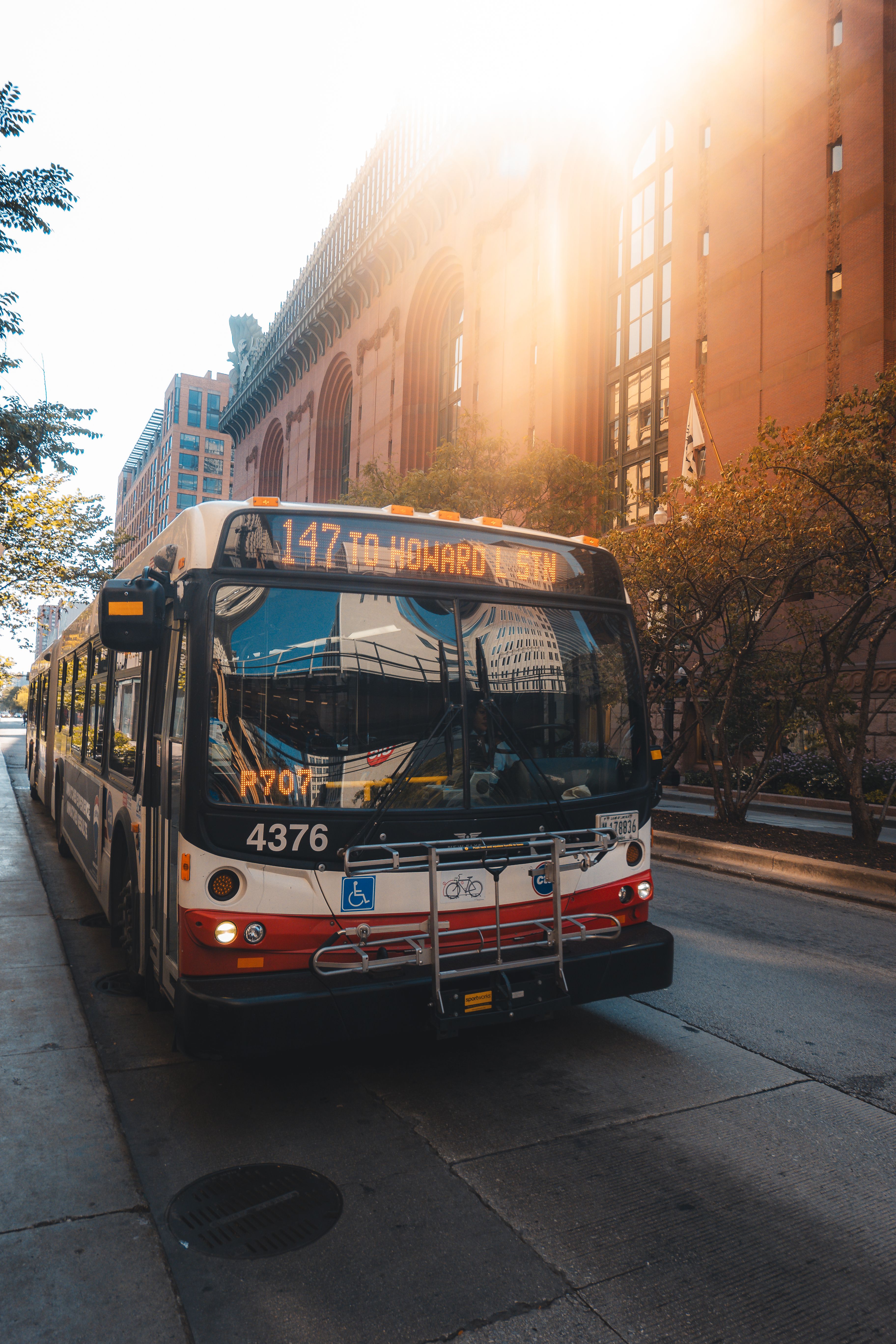 Chicago City Bus on Urban Street at Sunrise · Free Stock Photo