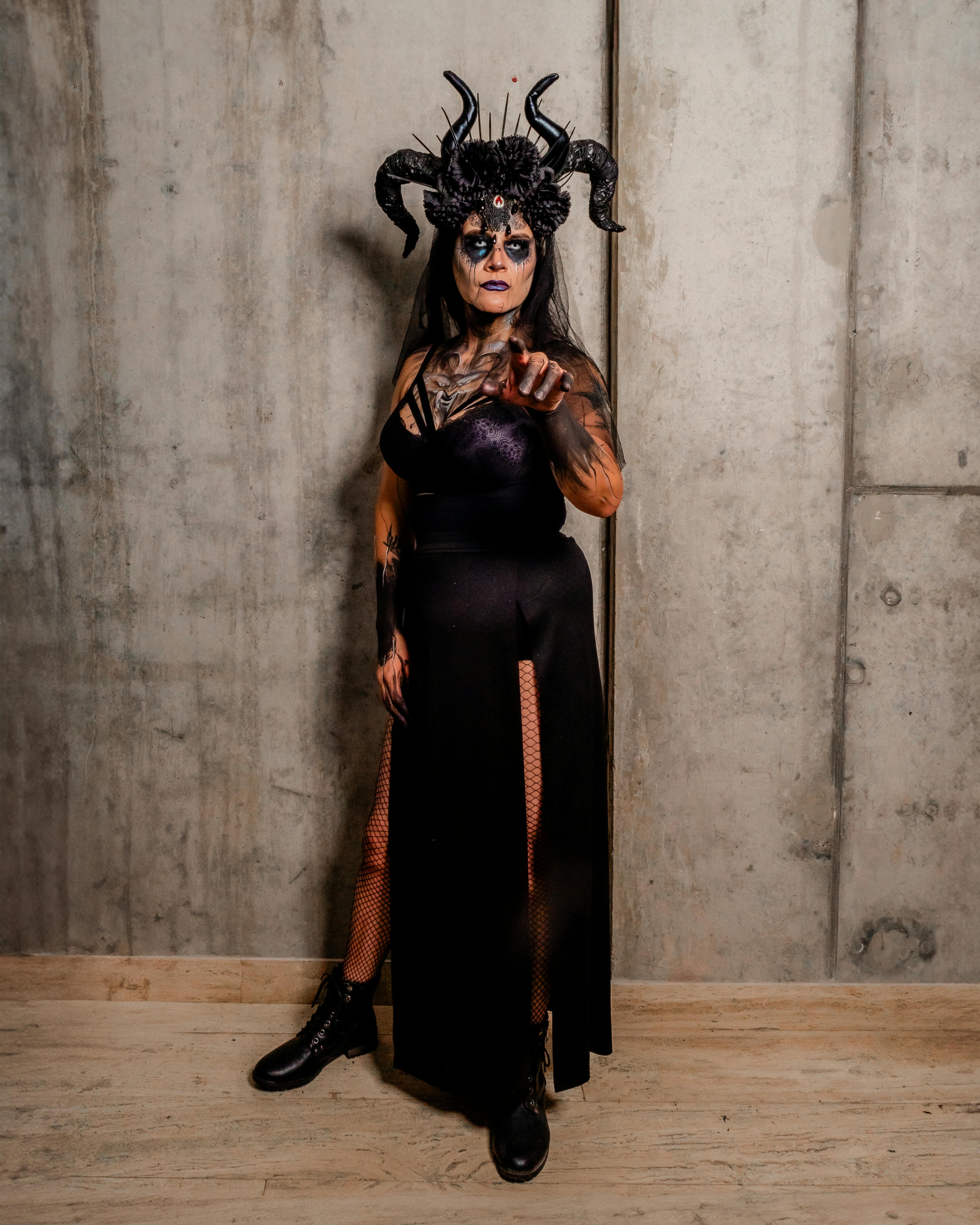 Eerie Woman in Horror Costume with Horned Headpiece · Free Stock Photo