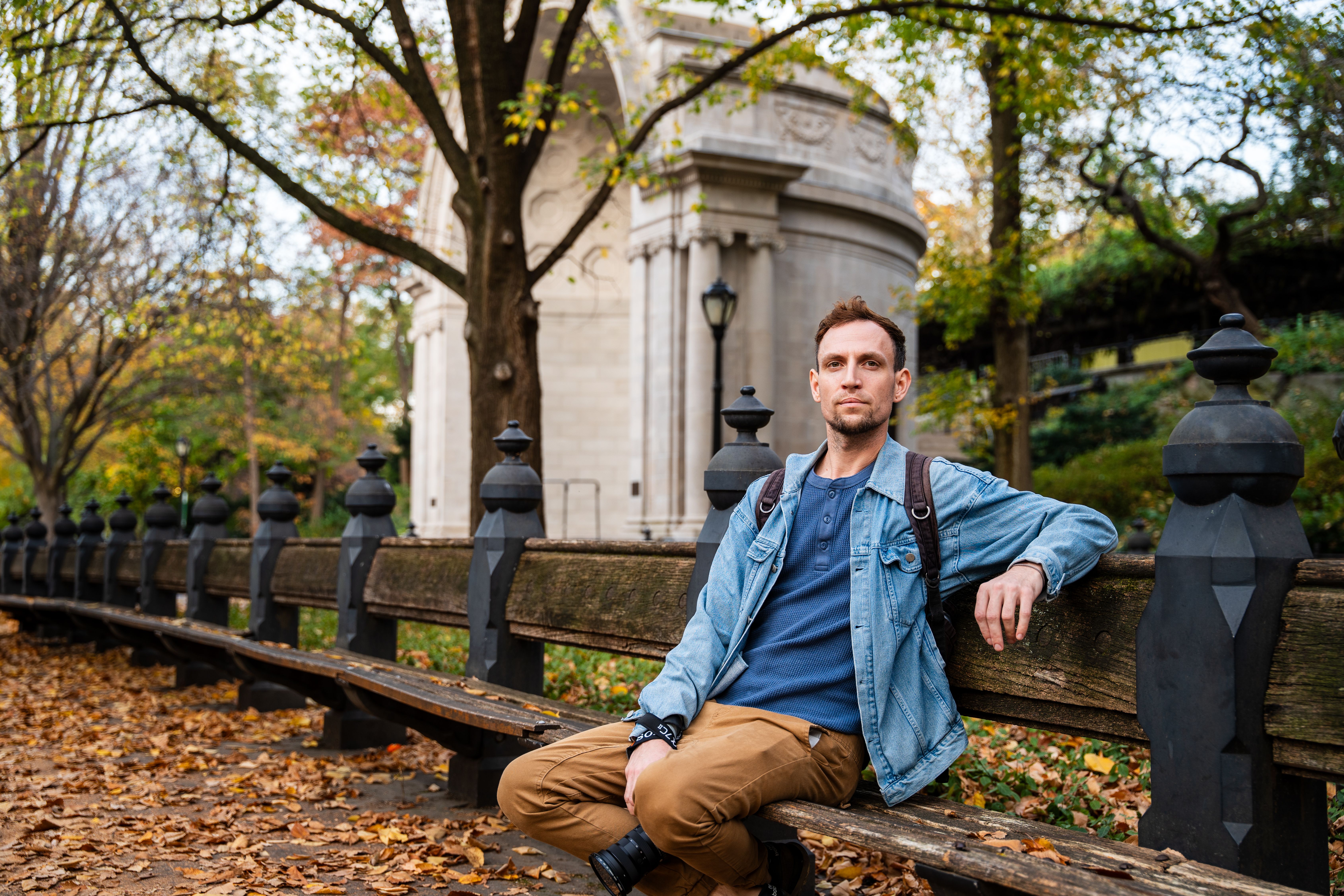 Man Relaxing on Central Park Bench in Autumn · Free Stock Photo