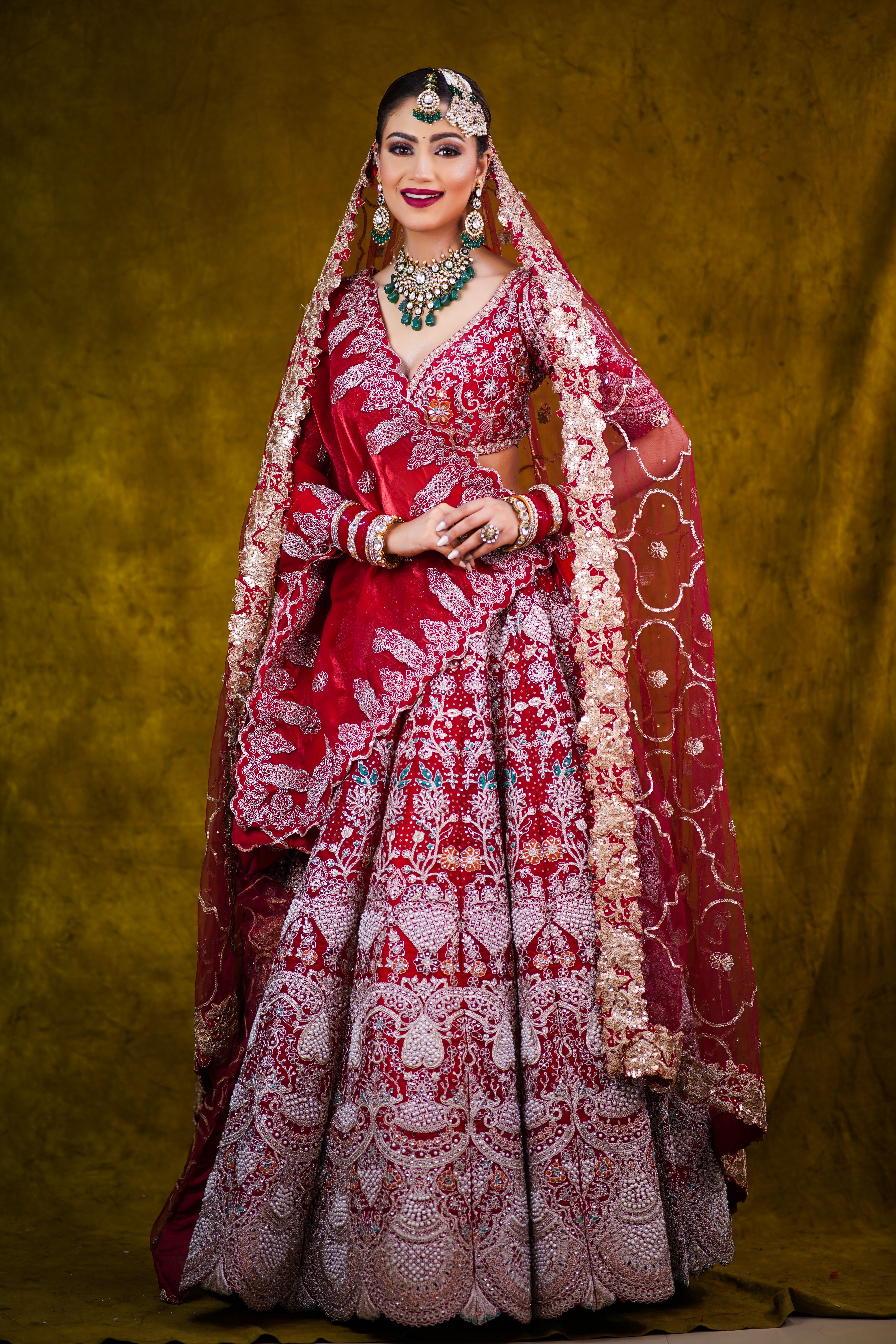 Elegant Traditional Bridal Portrait in Red Attire · Free Stock Photo