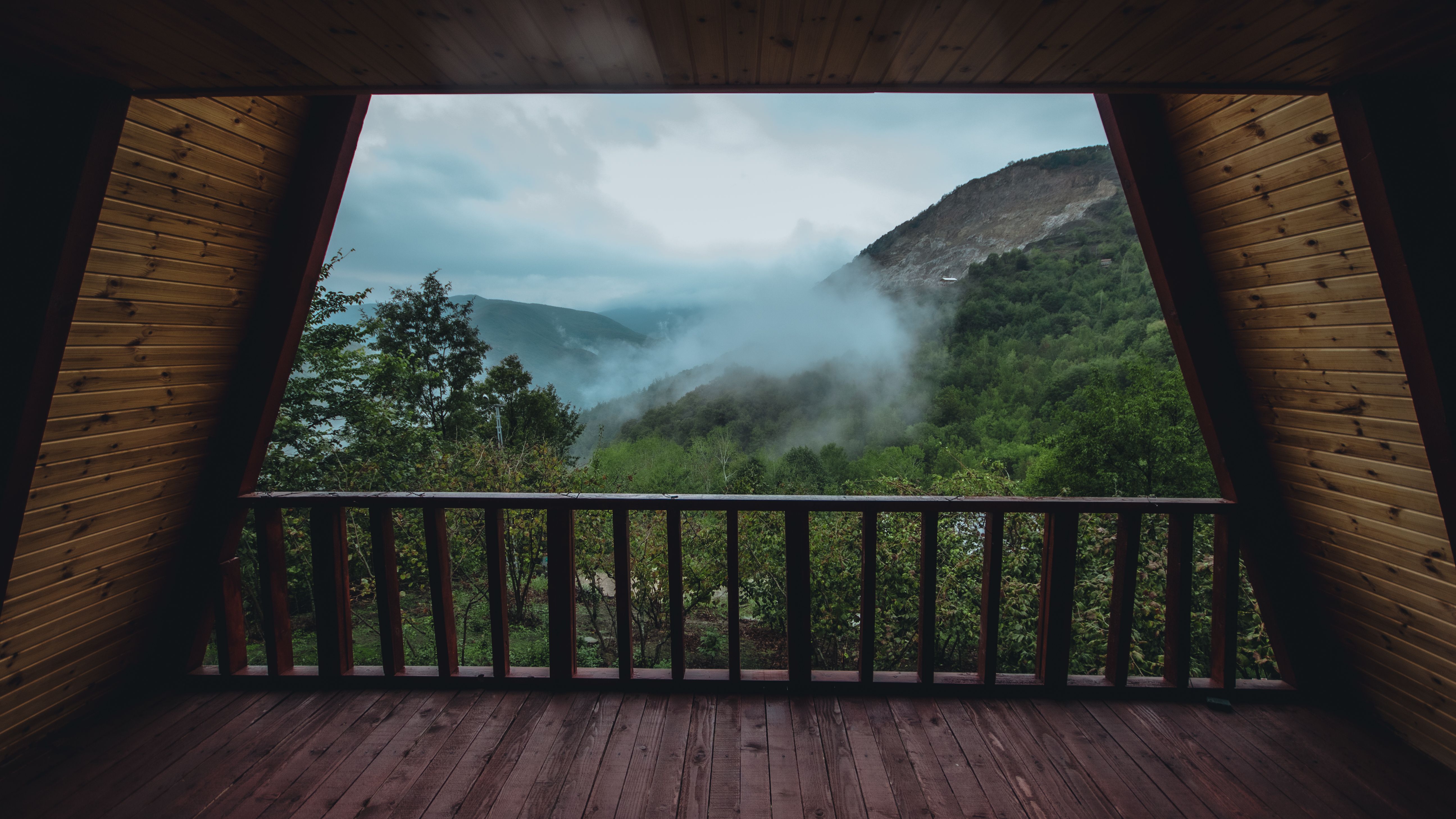 Scenic Mountain View from Wooden Cabin Balcony · Free Stock Photo