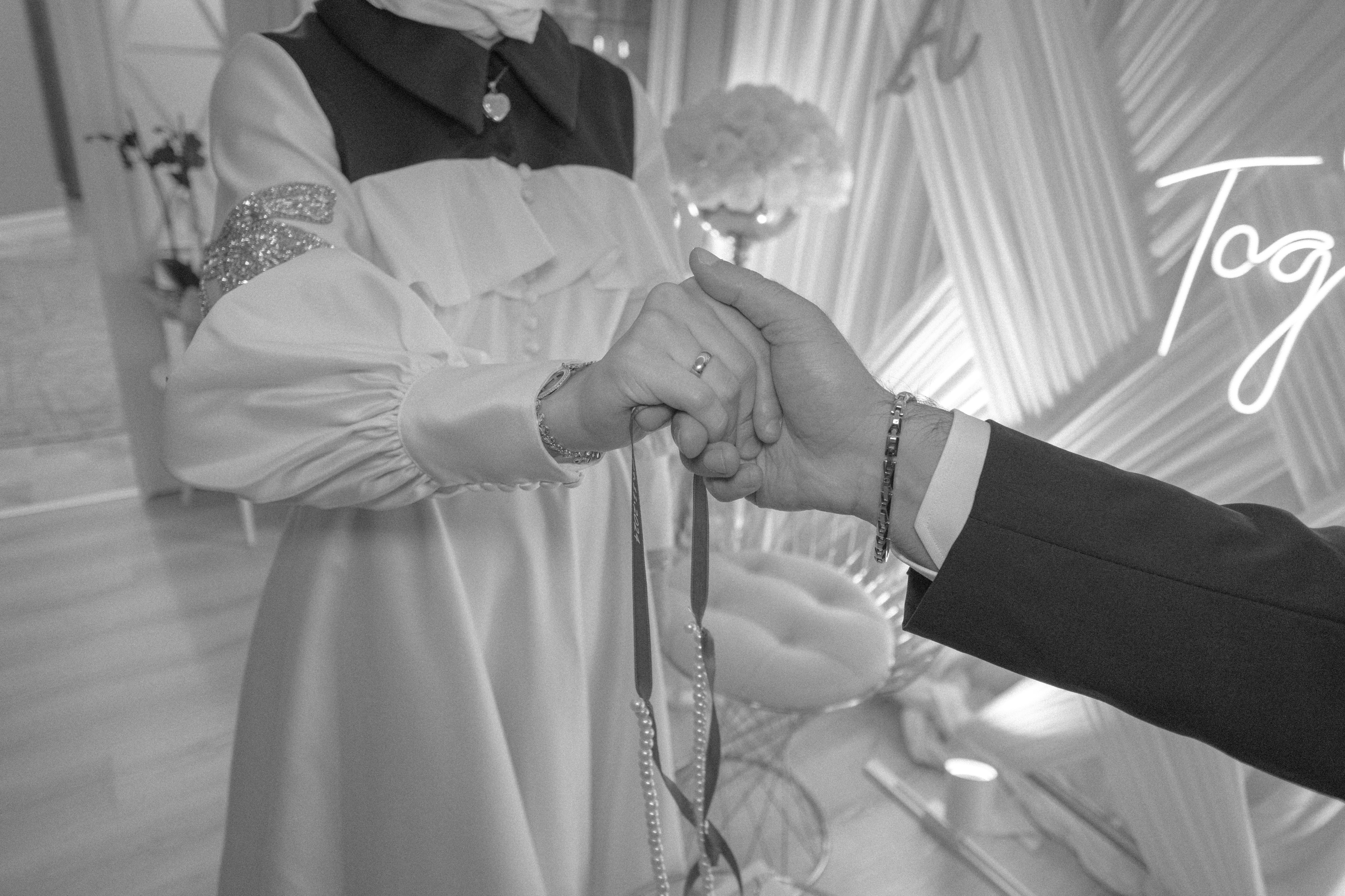 Elegant Couple Holding Hands at Event · Free Stock Photo