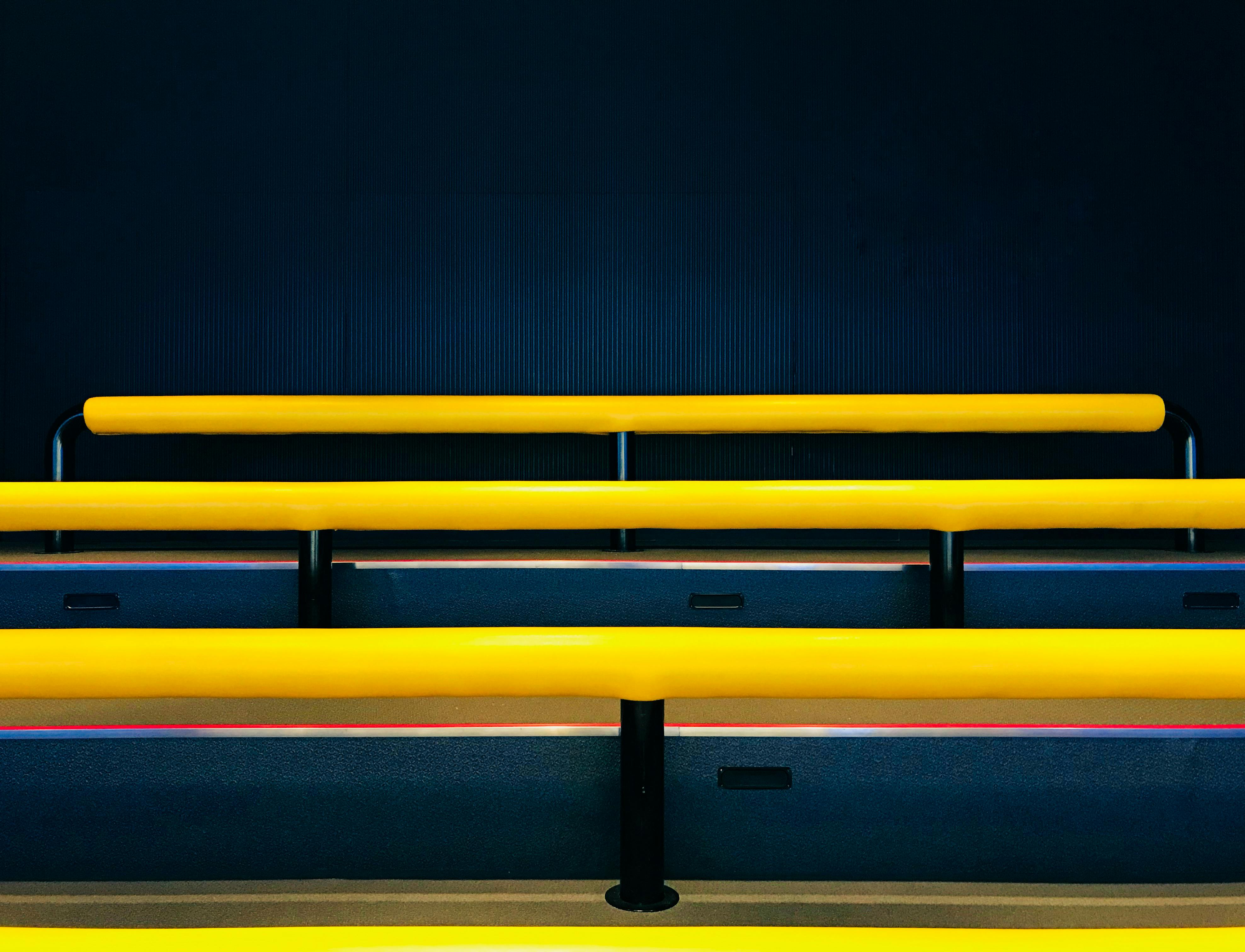 Bright Yellow Rails in Industrial Setting · Free Stock Photo