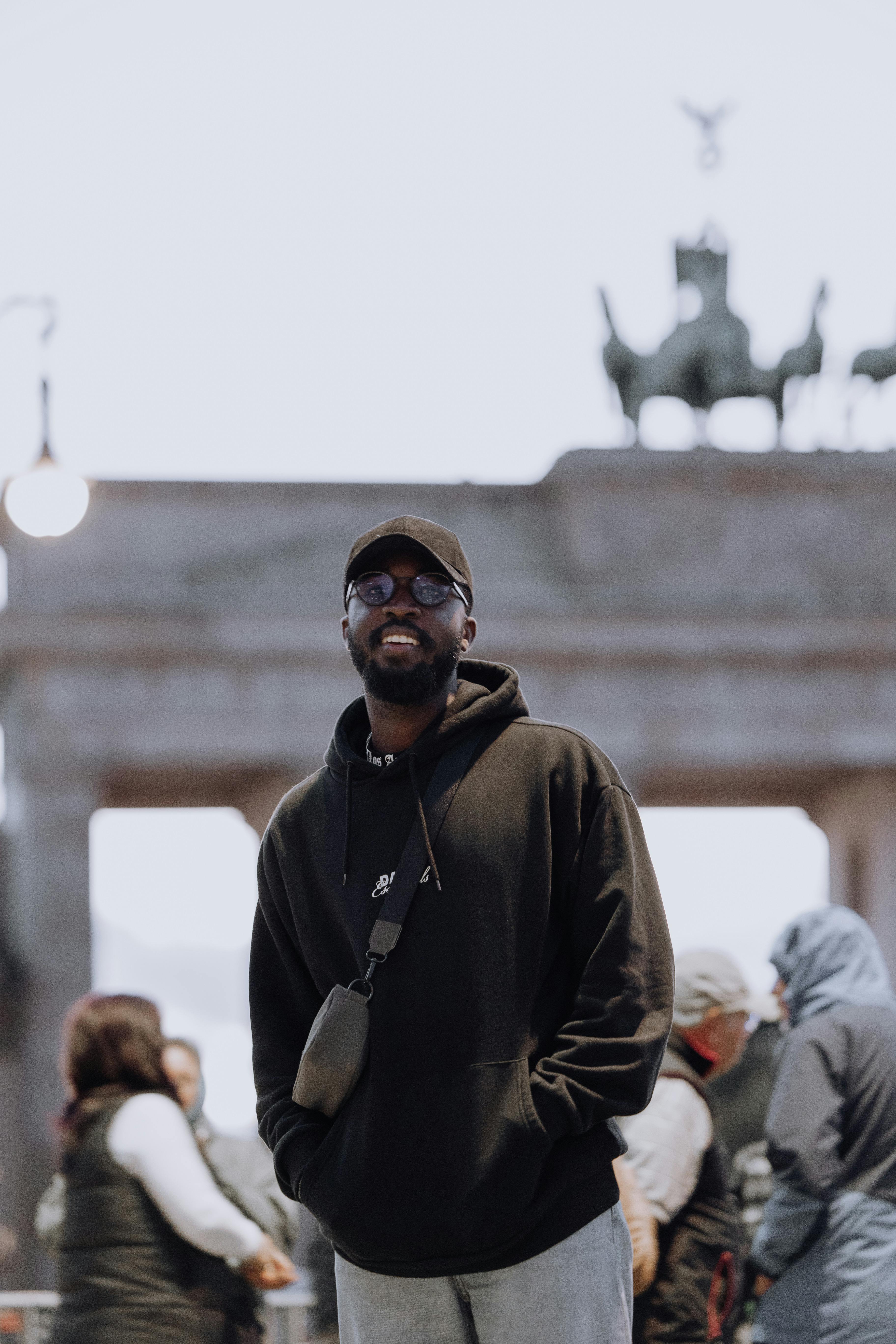 Portrait Against Brandenburg Gate in Berlin · Free Stock Photo