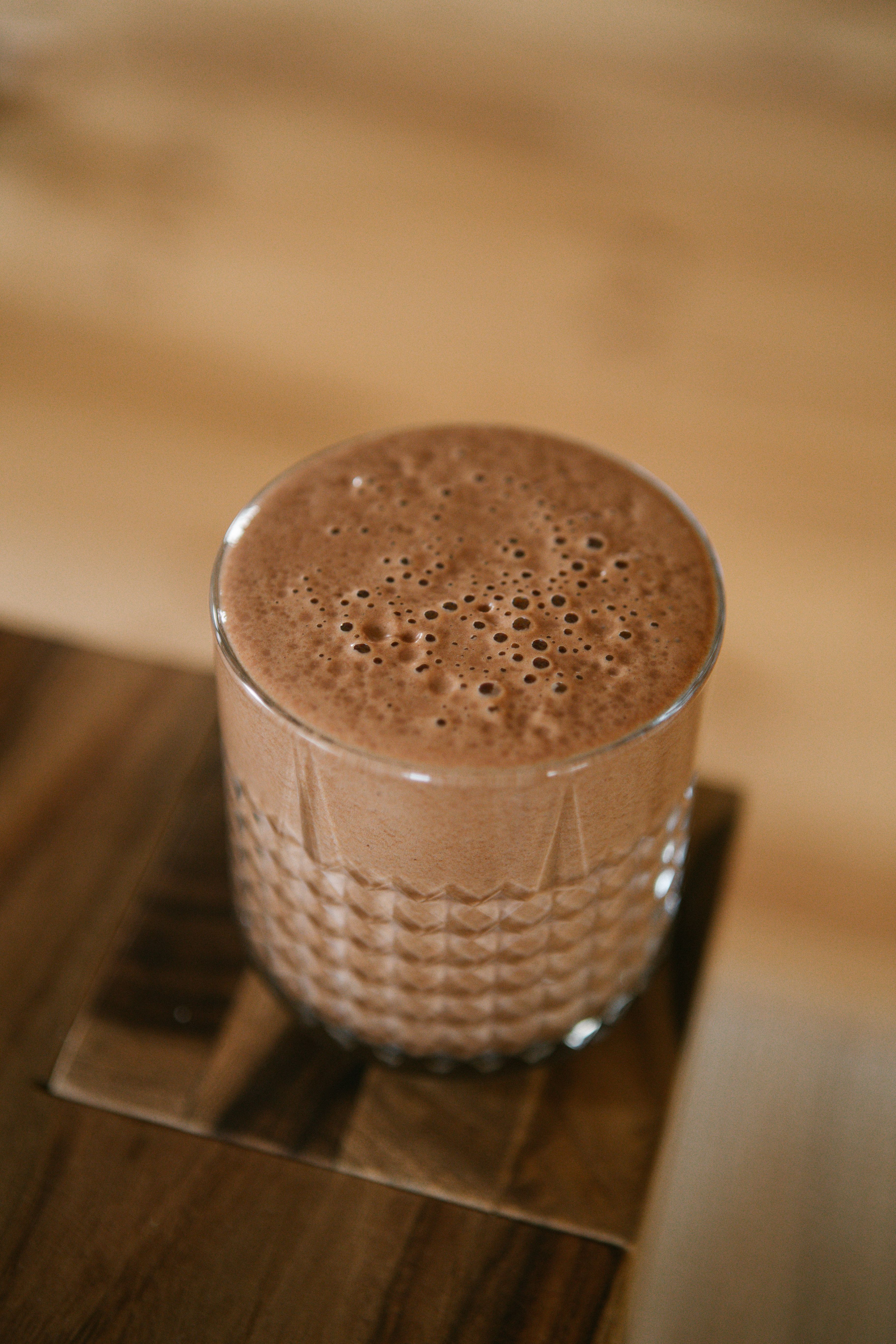 Rich Creamy Cacao Drink in Textured Glass · Free Stock Photo