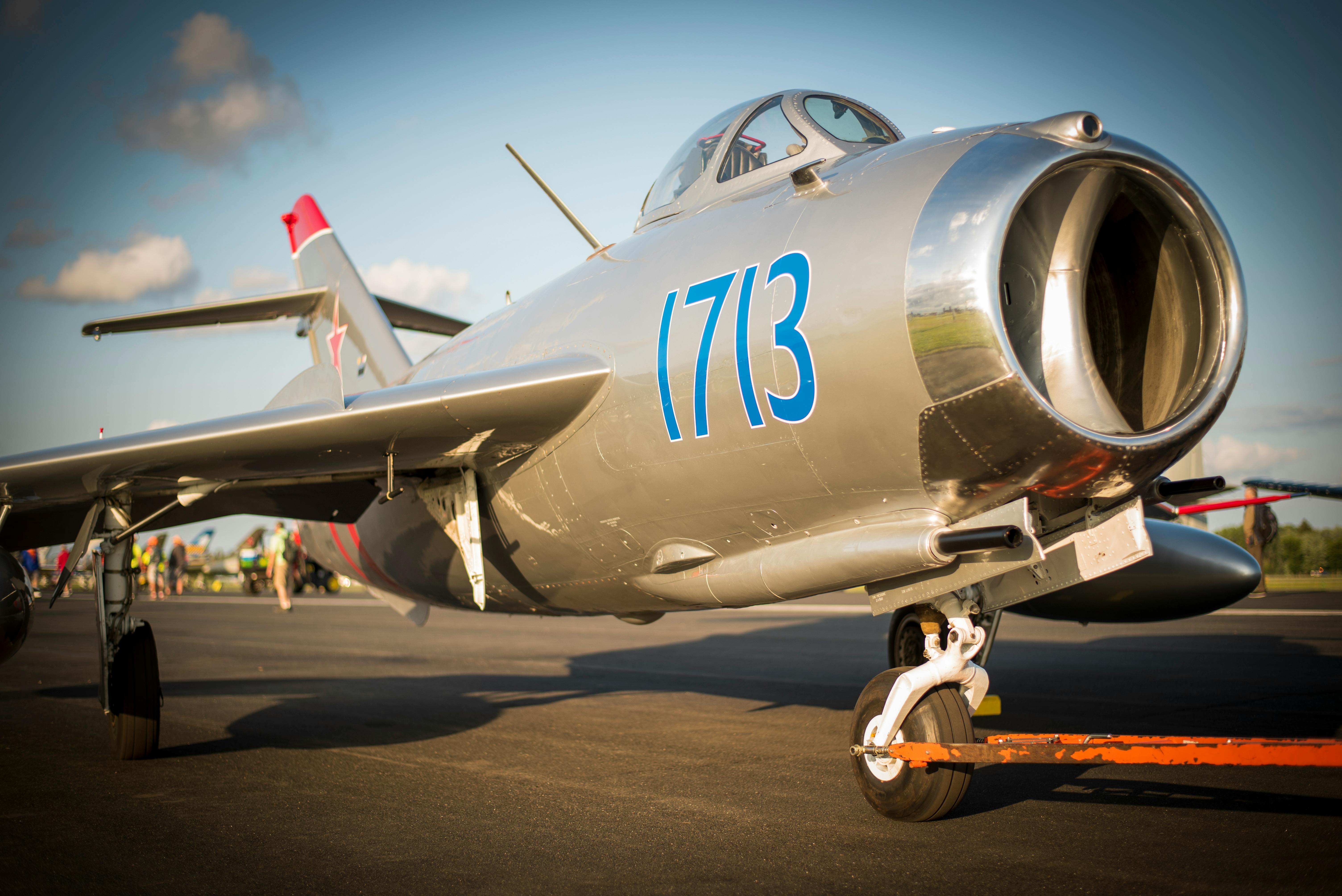Classic Silver Jet on Tarmac at Sunset · Free Stock Photo