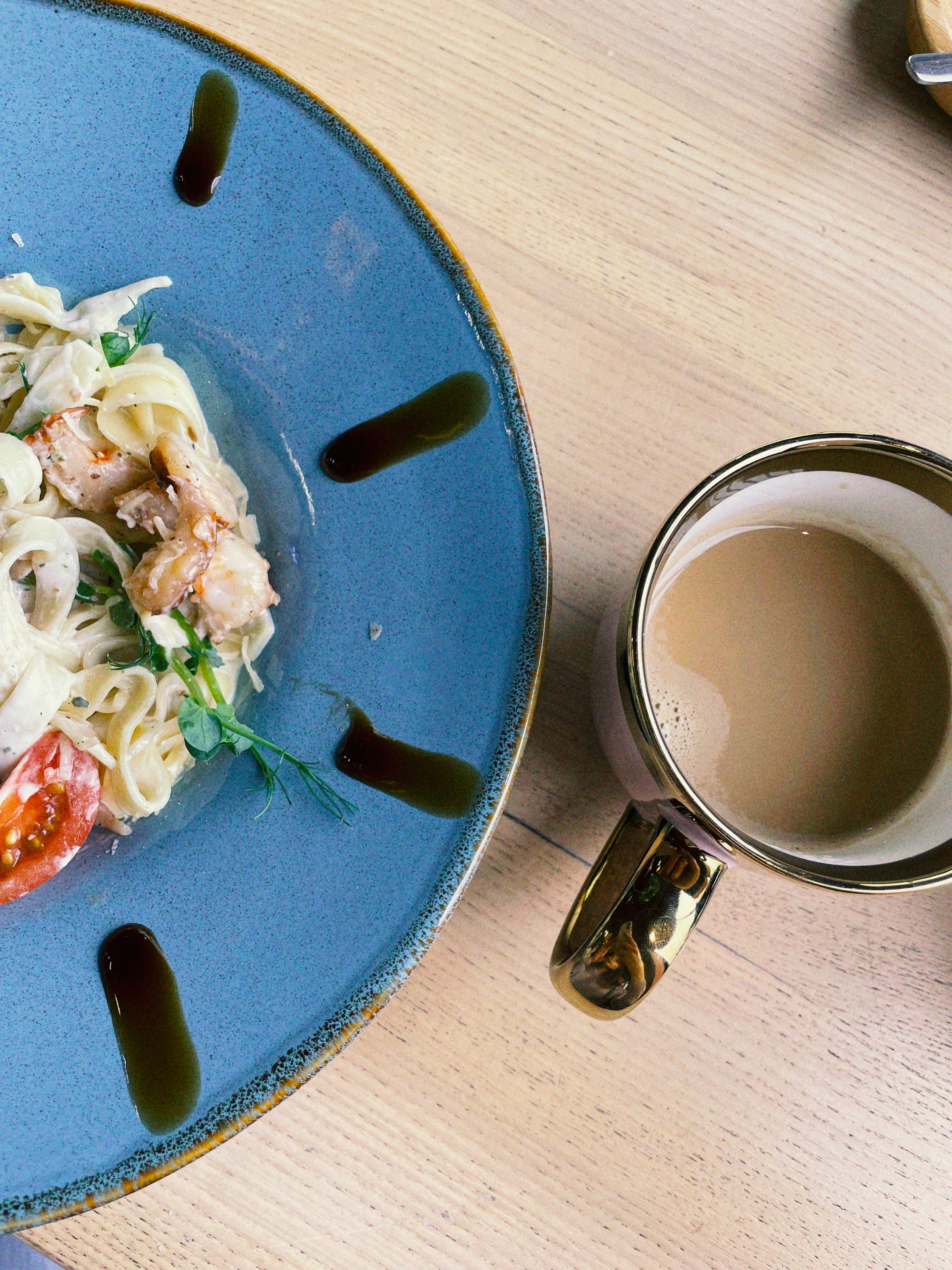 Pasta Dish with Coffee on Wooden Table · Free Stock Photo