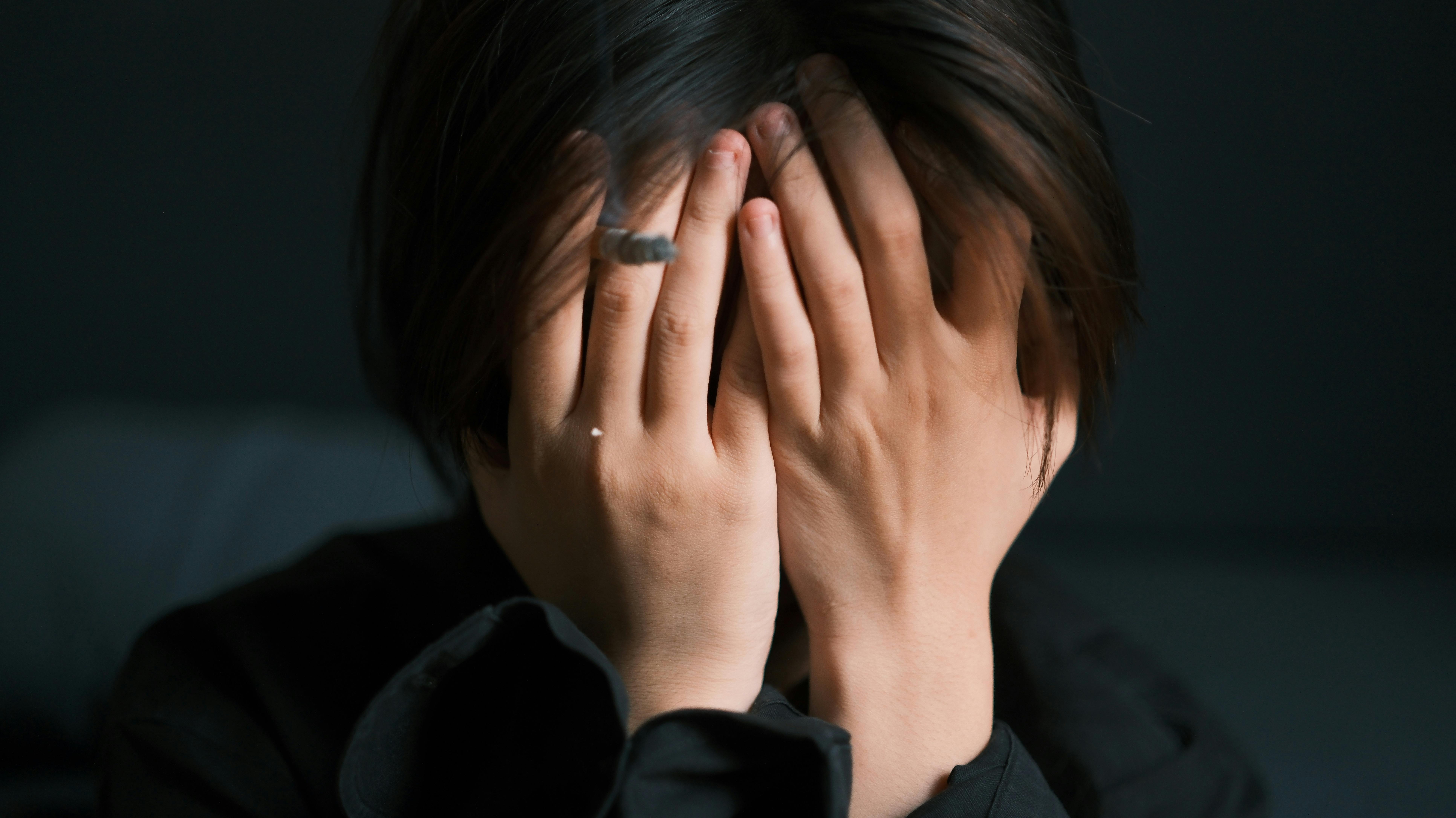 Woman Covering Face in Emotional Distress · Free Stock Photo