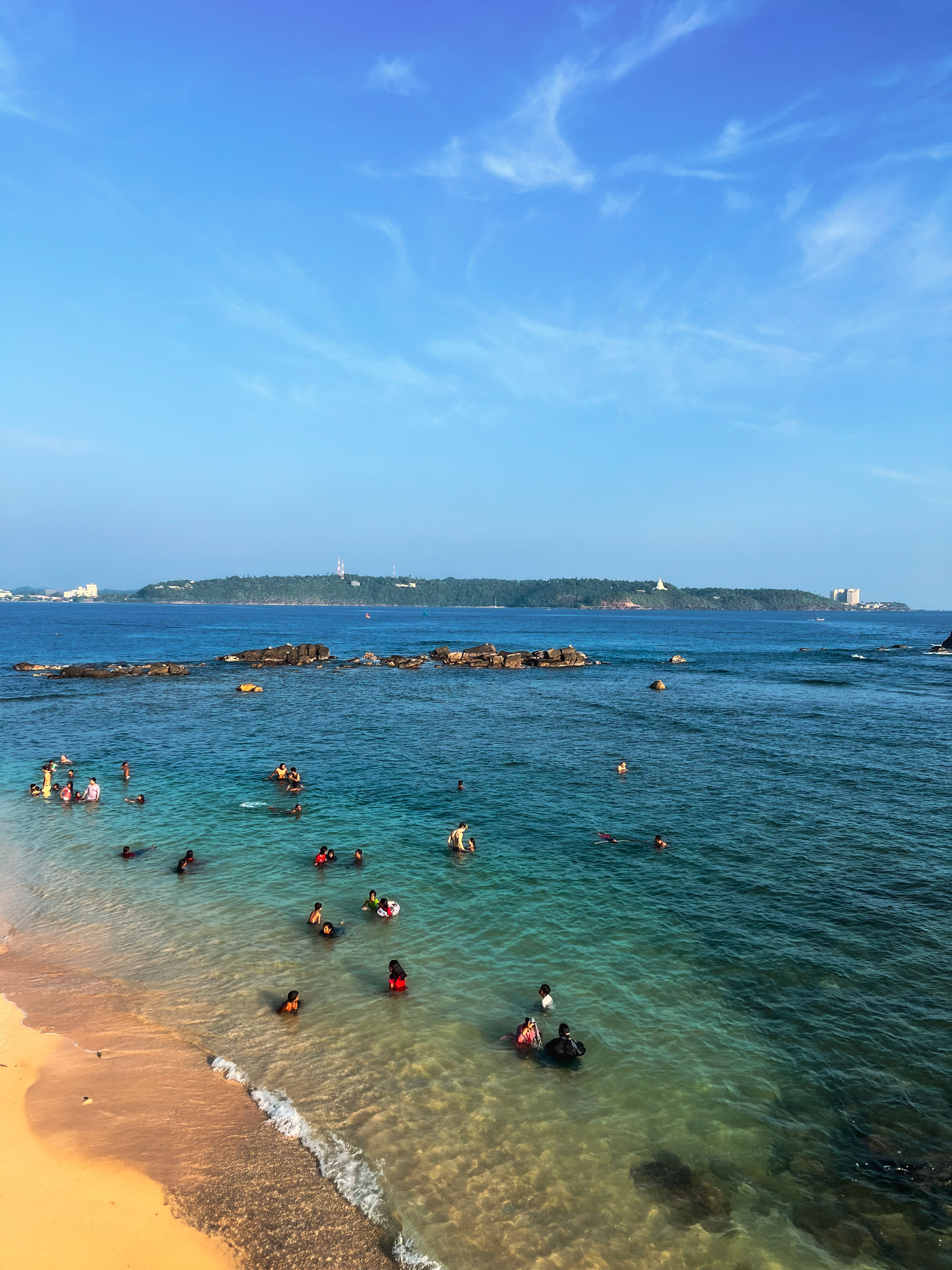 People Enjoying a Sunny Day at the Beach · Free Stock Photo